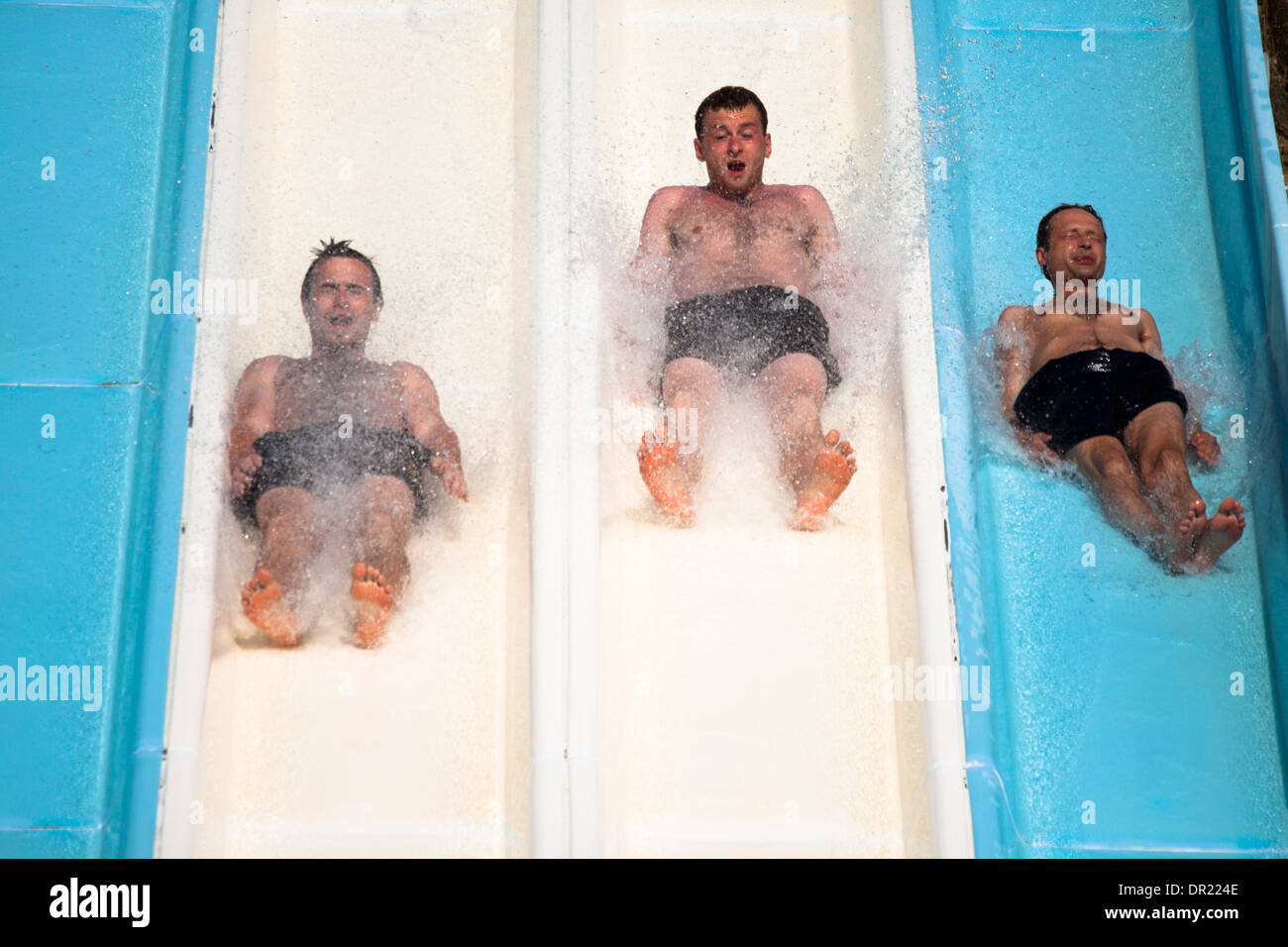 People water slide at aqua park Stock Photo - Alamy