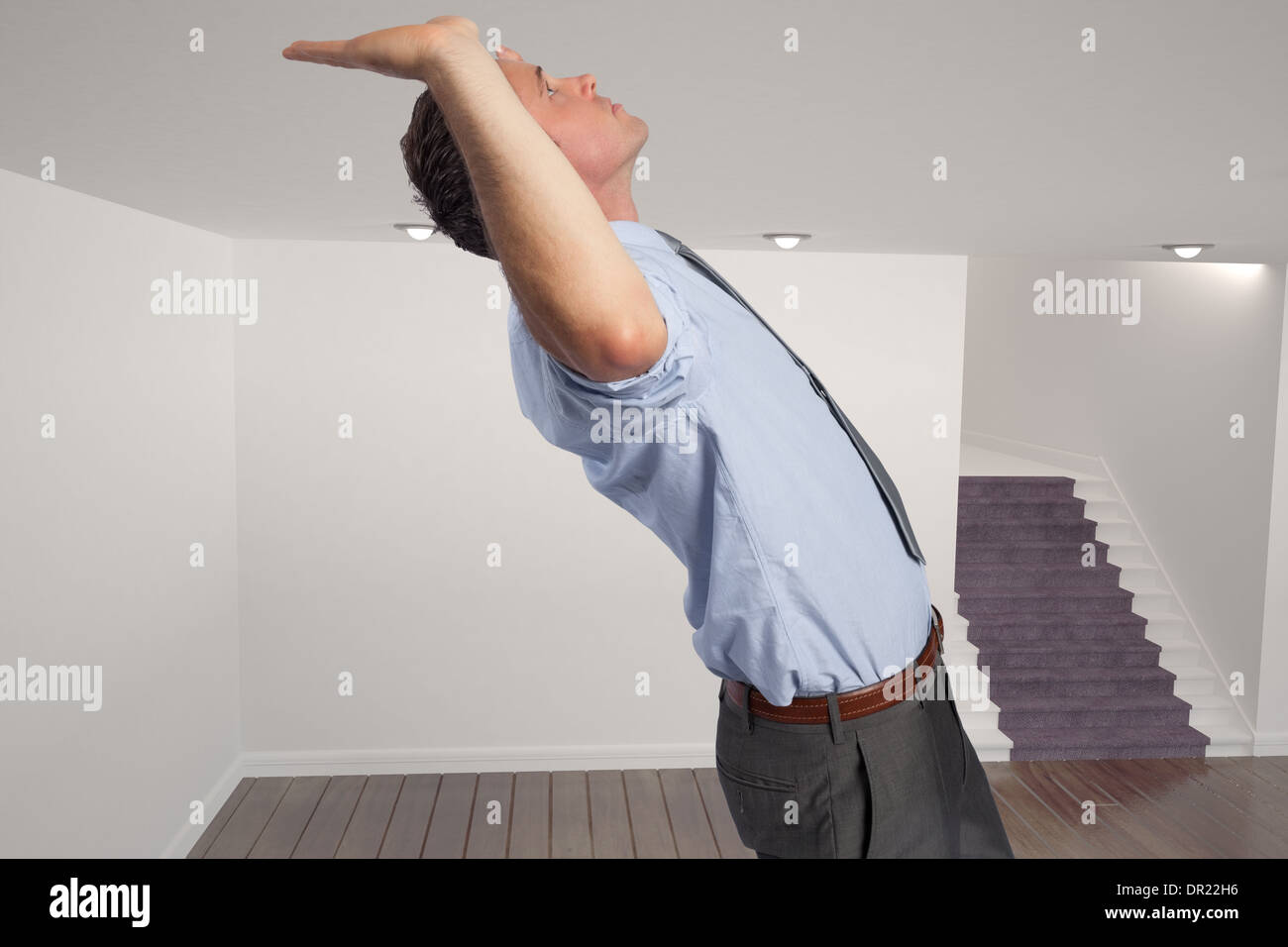 Composite image of businessman standing with hands up Stock Photo - Alamy