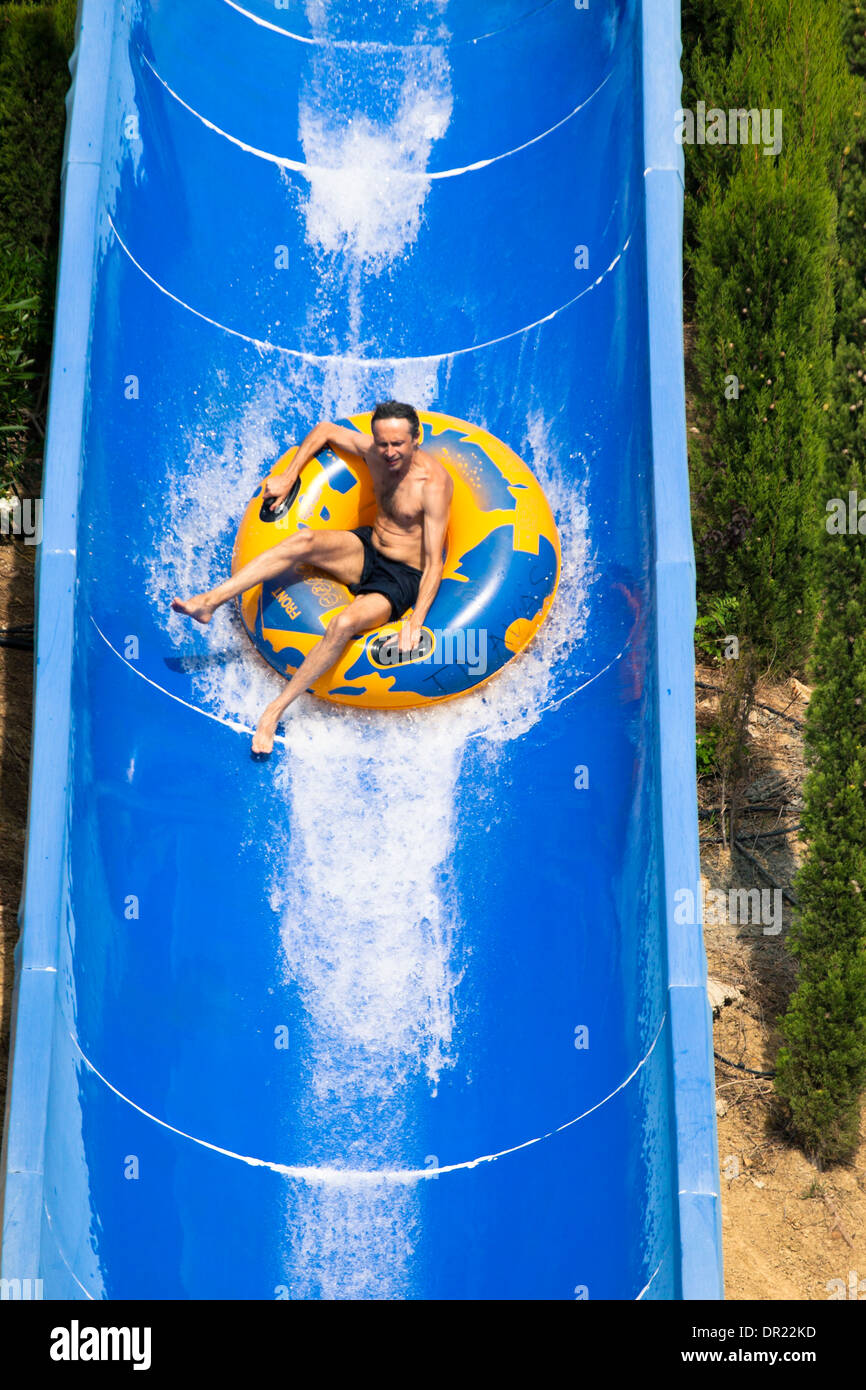 Man water sliding aqua park hi-res stock photography and images - Alamy