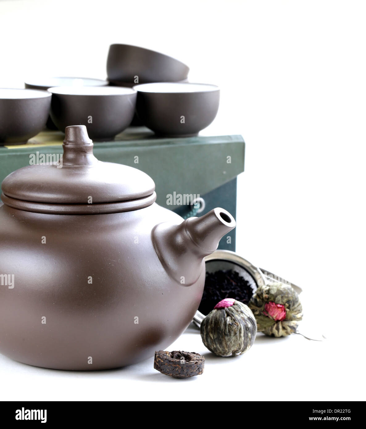 set for a traditional tea drinking (kettle, cups and various grain tea ...