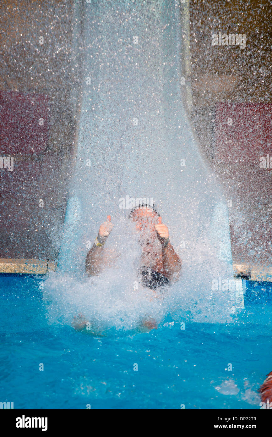 Man water sliding at aqua park Stock Photo - Alamy