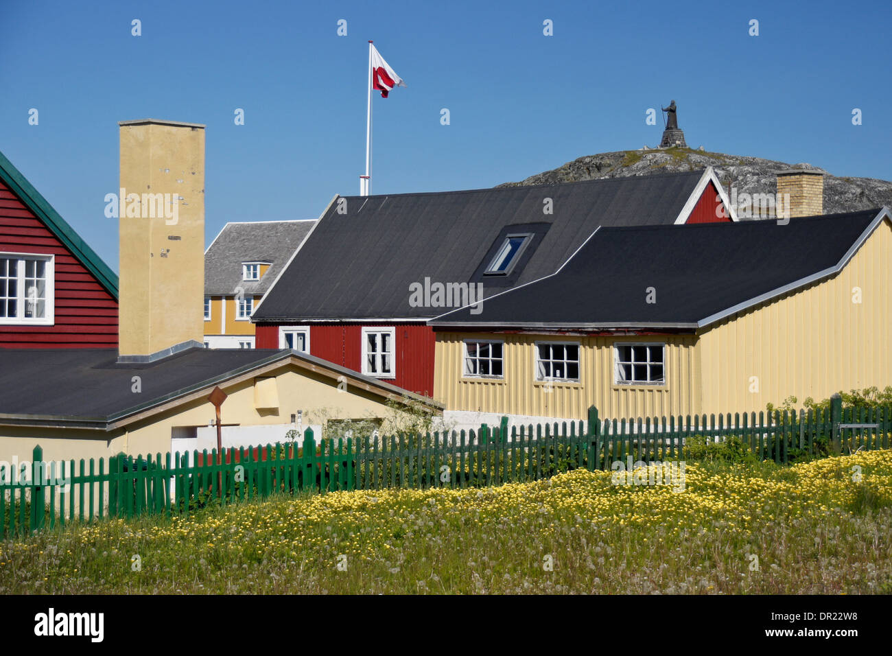 Hans Egede statue on hill and colorful houses in Nuuk (Godthab ...