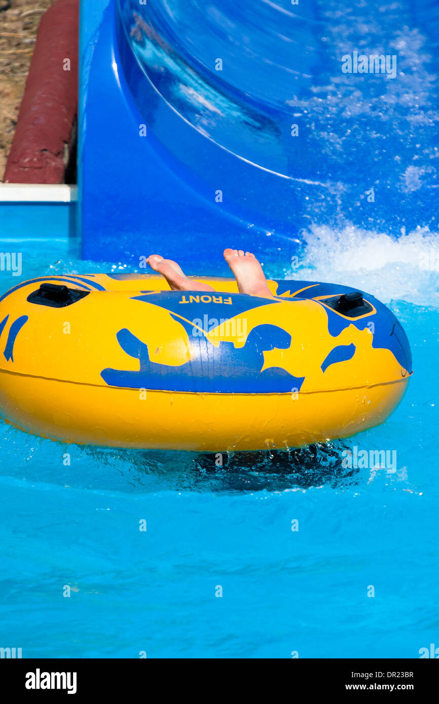 Man water sliding at aqua park Stock Photo - Alamy