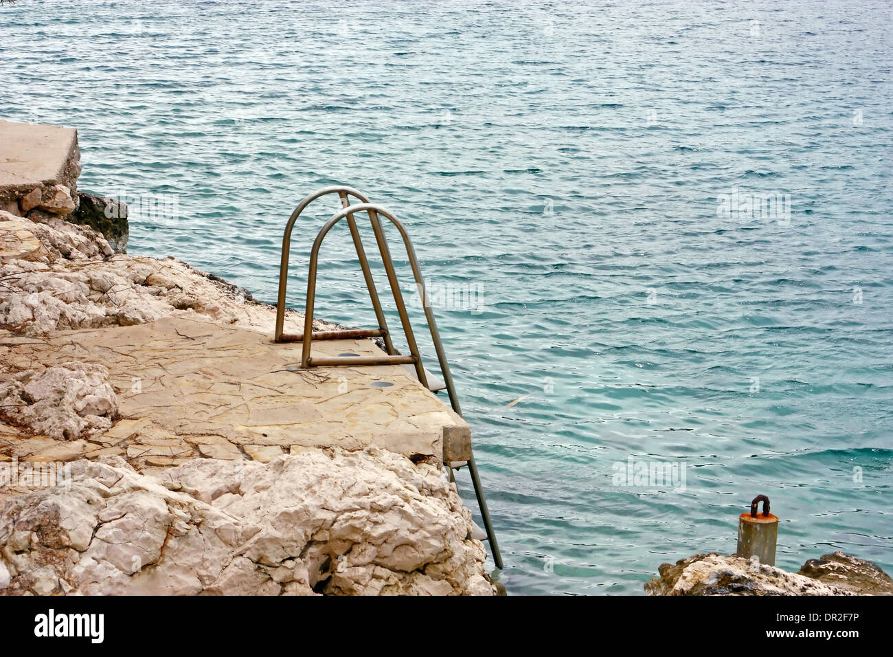 Ladder on rocky coast of the Mediterranean sea Stock Photo - Alamy