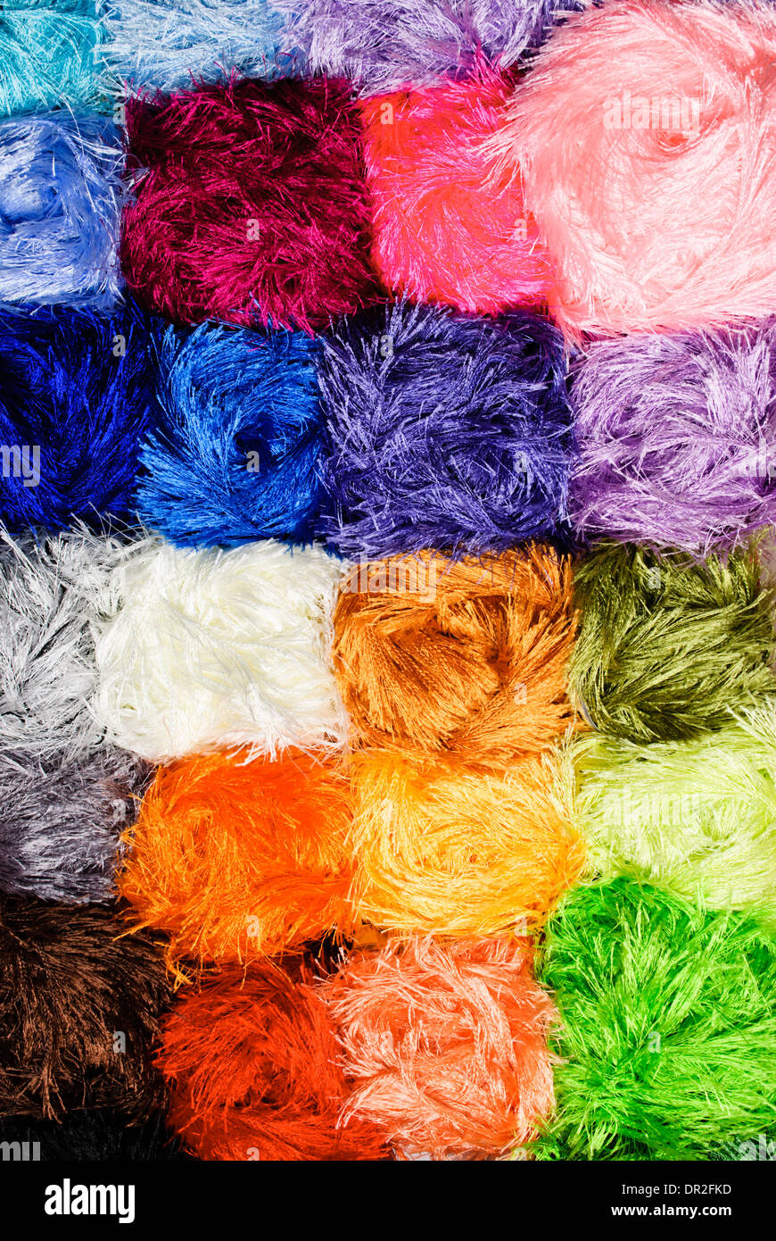 Different color "grass" threads on rows in the store Stock Photo - Alamy