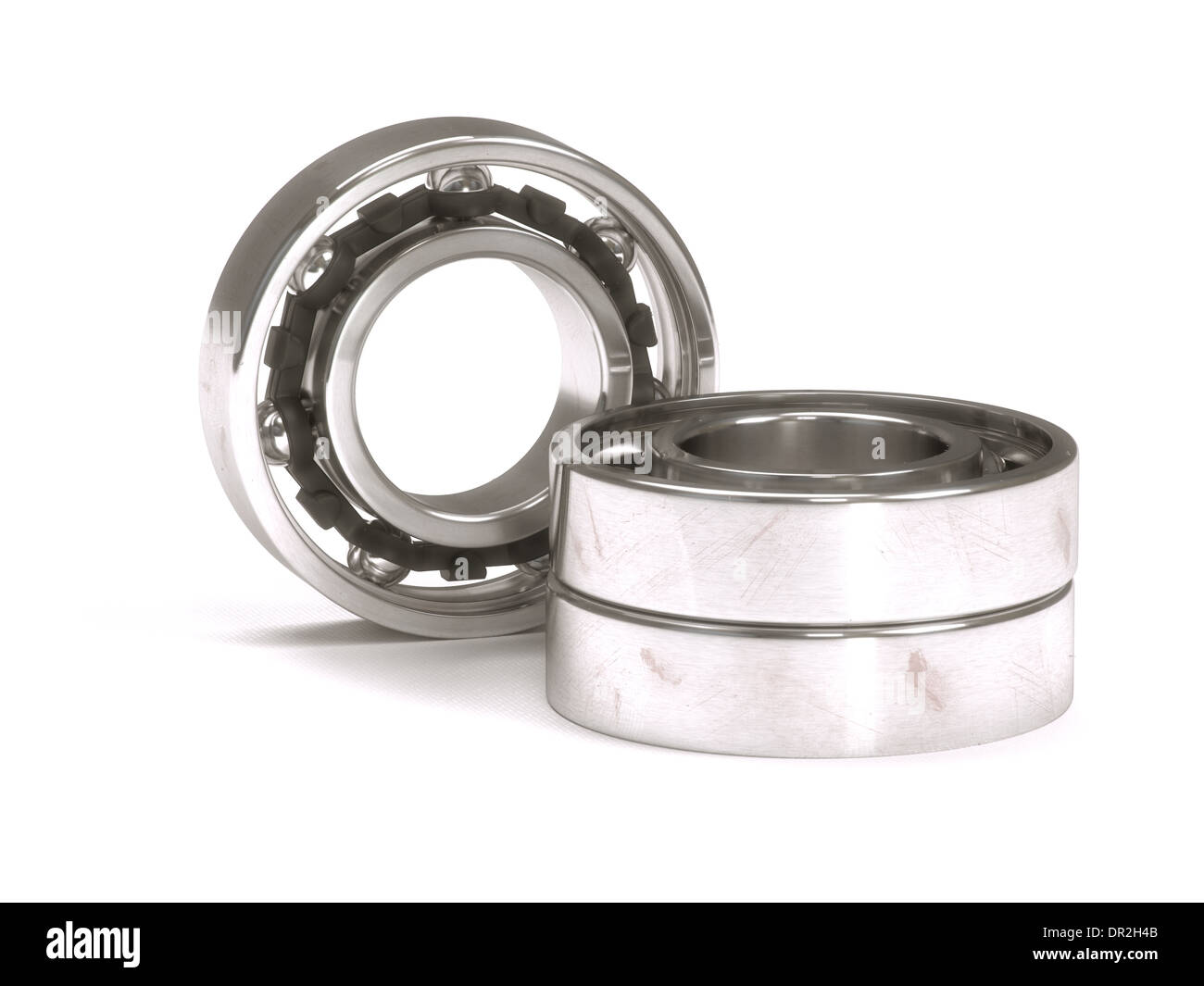 Ball bearing behind a stack of two ball bearings isolated on white ...
