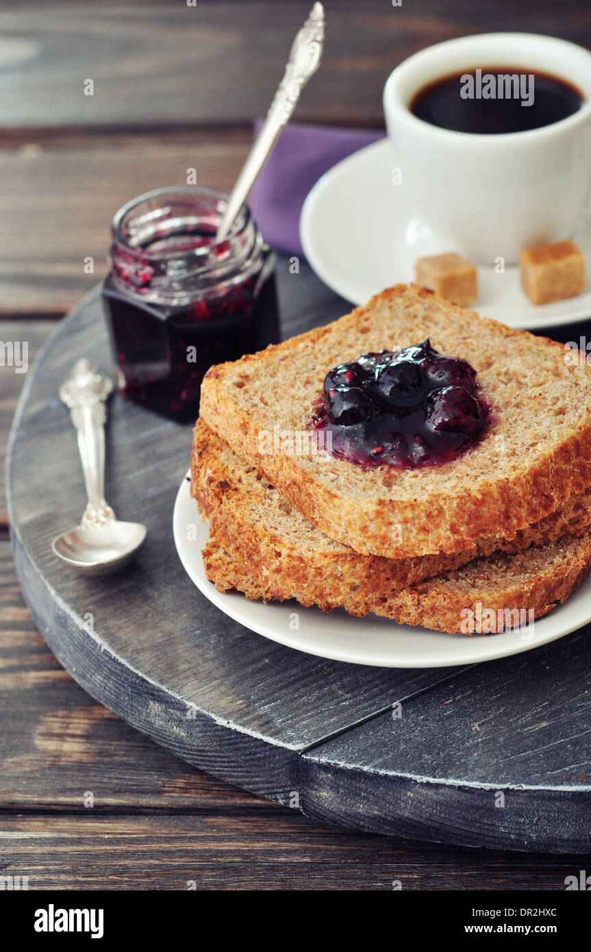 Breakfast with toast, fruit jam and coffee on tray Stock Photo - Alamy