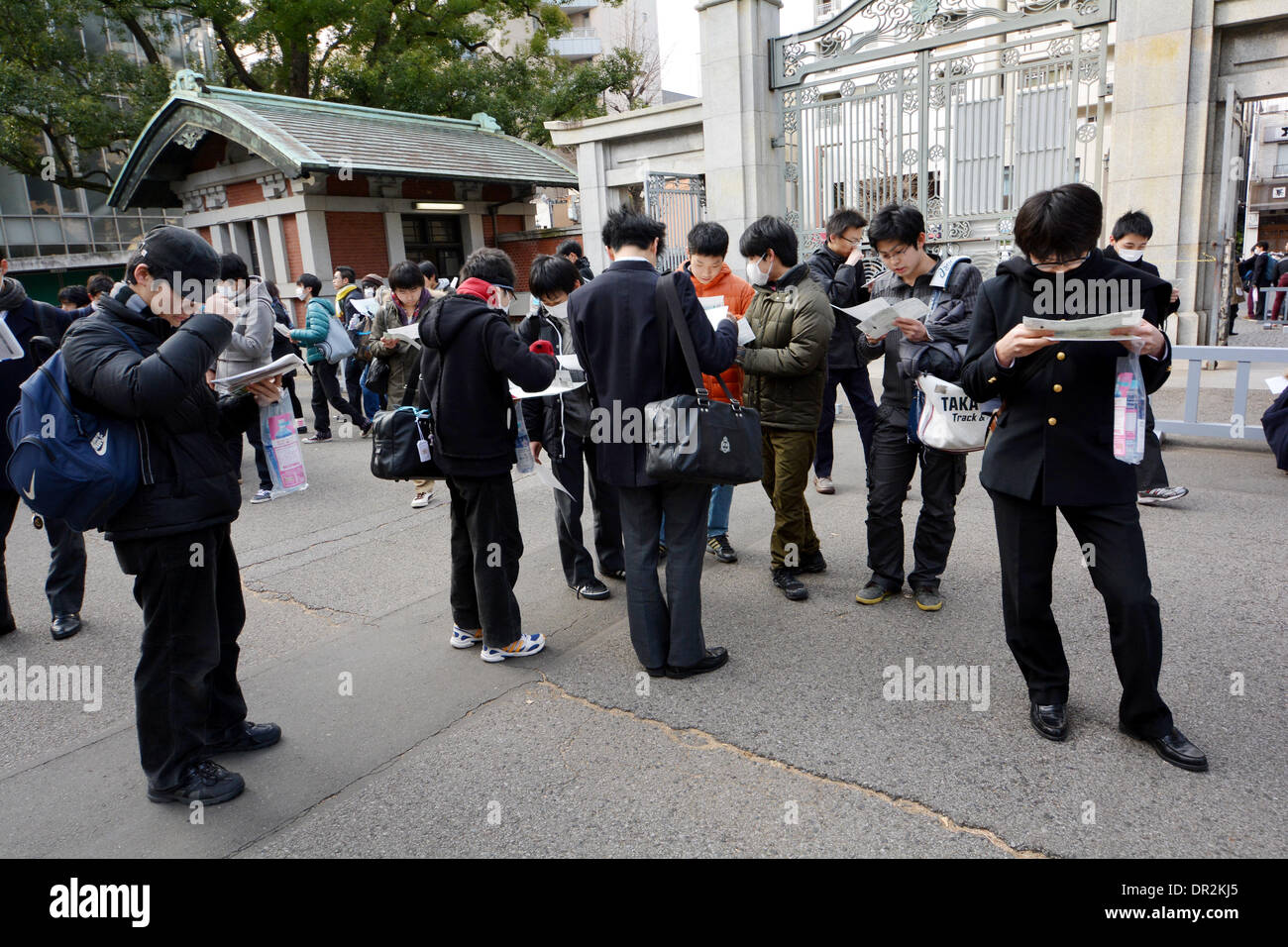 Tokyo, Japan. 18th Jan, 2014. Japanese test examinees check their ...