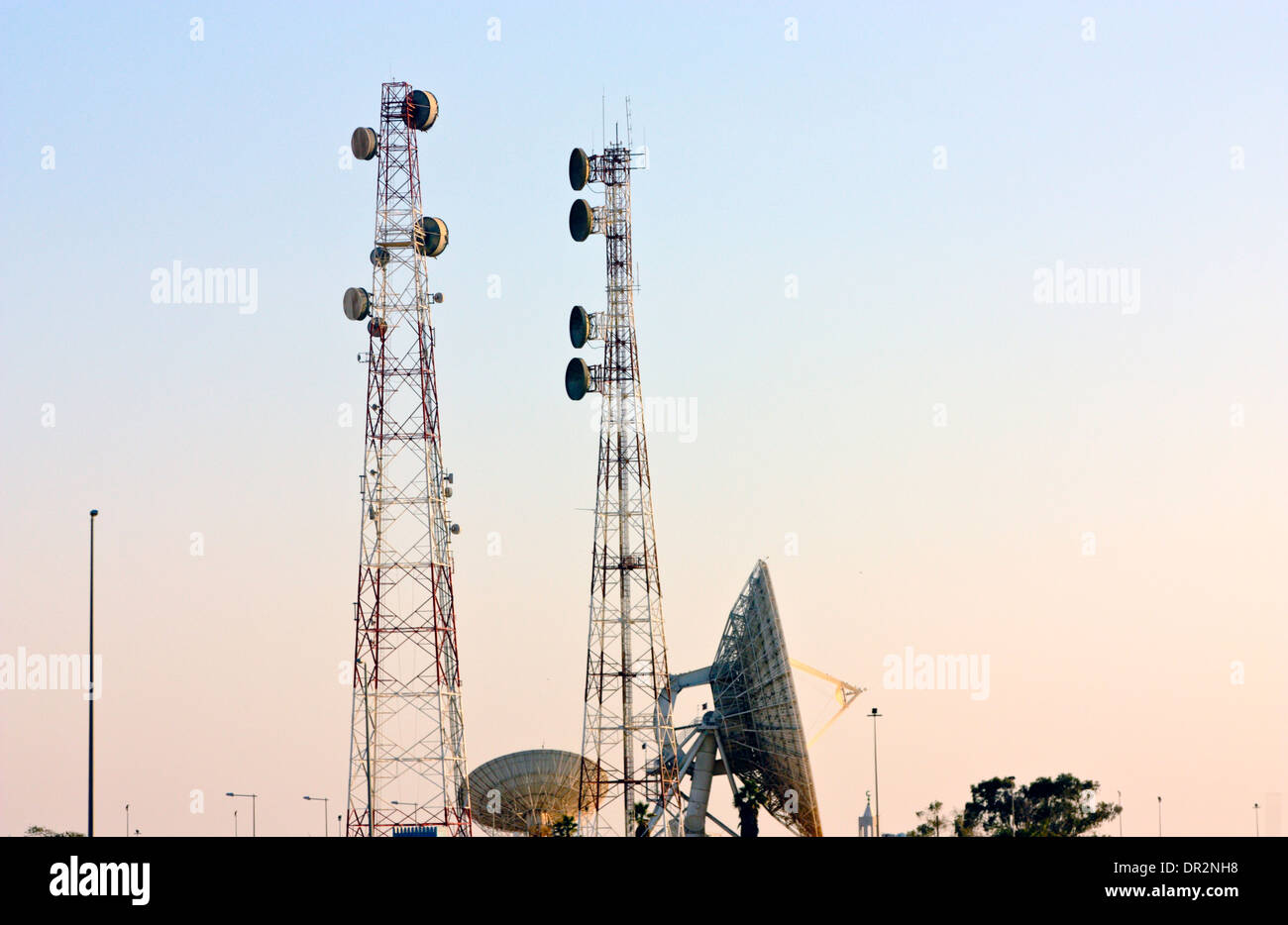 Telecommunication towers and satellite dish antennas in the Qatar desert Stock Photo - Alamy