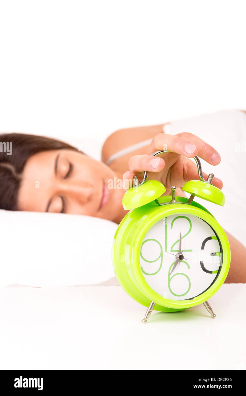 Woman waking up with the sound of the alarm clock Stock Photo - Alamy