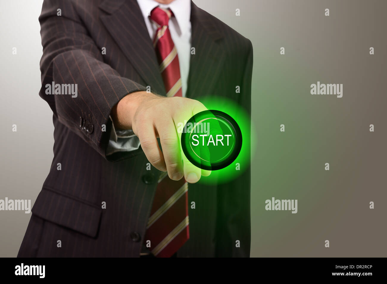 businessman push to start button concept Stock Photo - Alamy