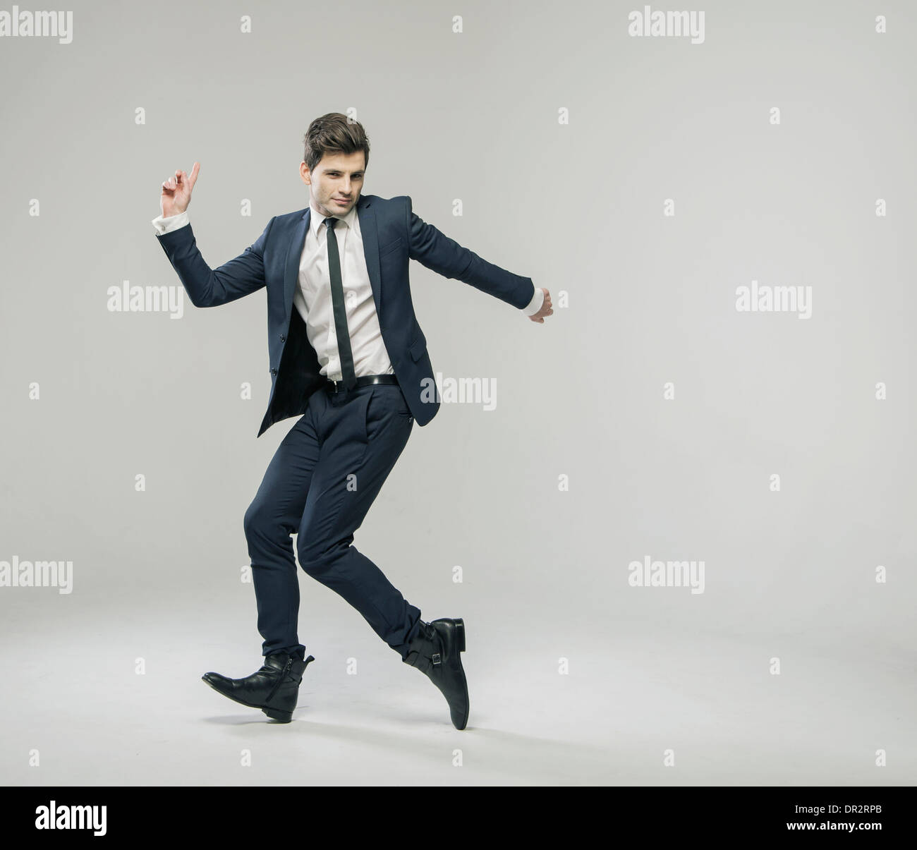Smart young man in victorious gesture Stock Photo - Alamy