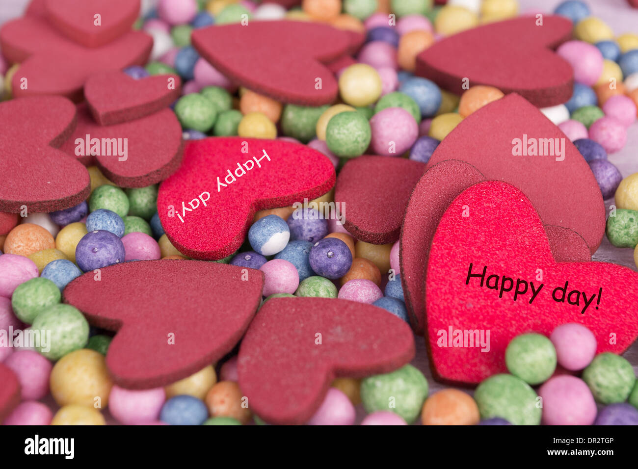 Red hearts background happy day sign Stock Photo - Alamy
