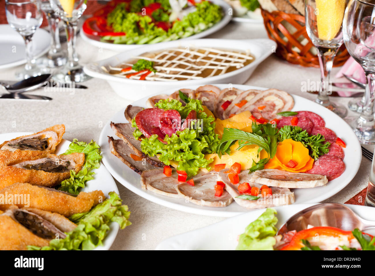 Various meat slices on white plate - collation Stock Photo - Alamy