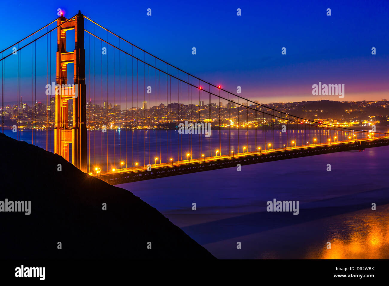 San Francisco Golden Gate Bridge sunset view through cables in ...