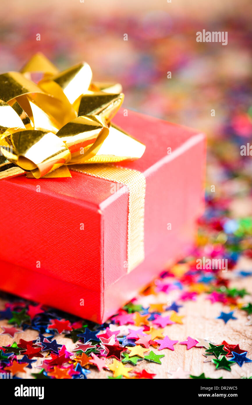 Small red gift box closeup with gold bow special for jewelery Stock ...