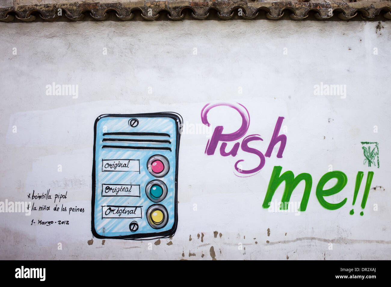 Entry phone mural with three buttons on a wall in Cordoba, Andalusia ...