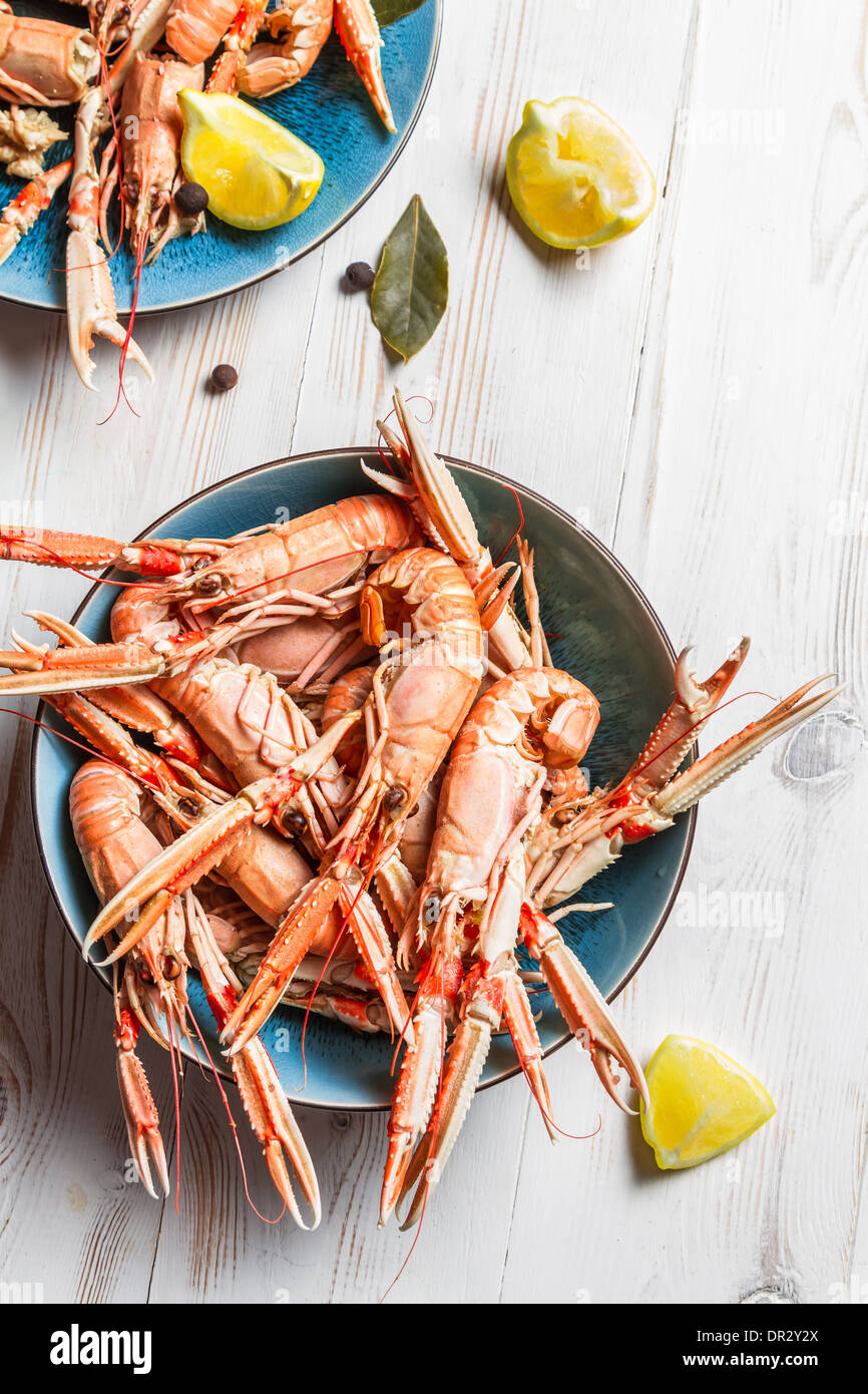 Lobster with lemon as a seafood dish Stock Photo - Alamy