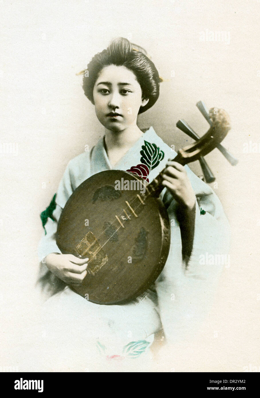 Geisha playing musical instrument Stock Photo - Alamy