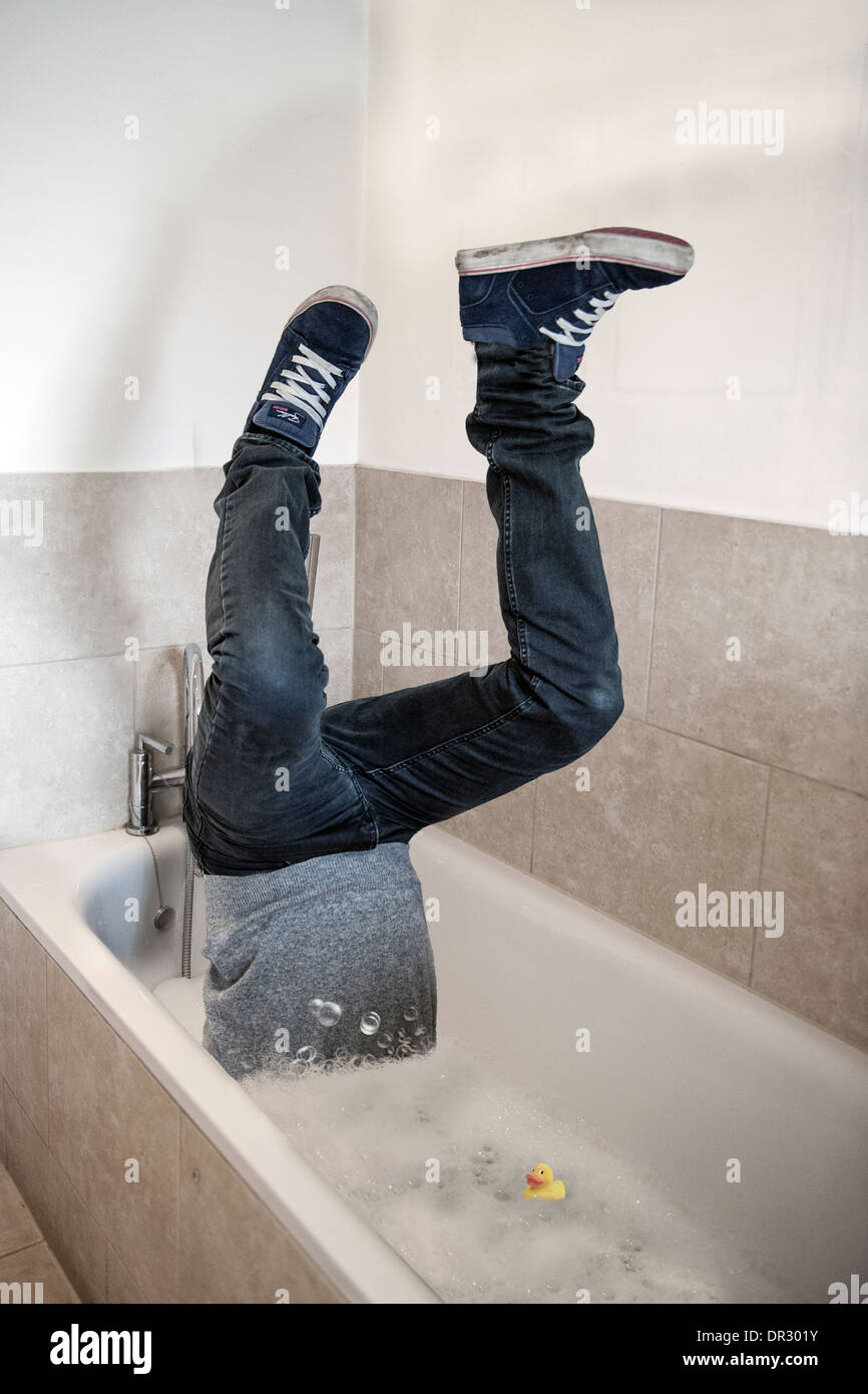 A Man Looks Like He S Being Sucked Down A Plughole In The Bath Stock