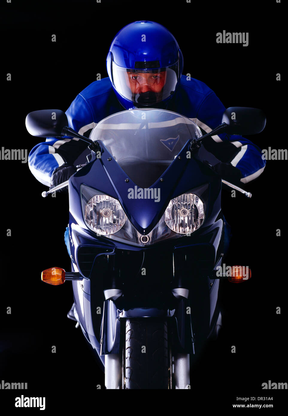 Studio cutout of a man on a motorcycle Stock Photo - Alamy