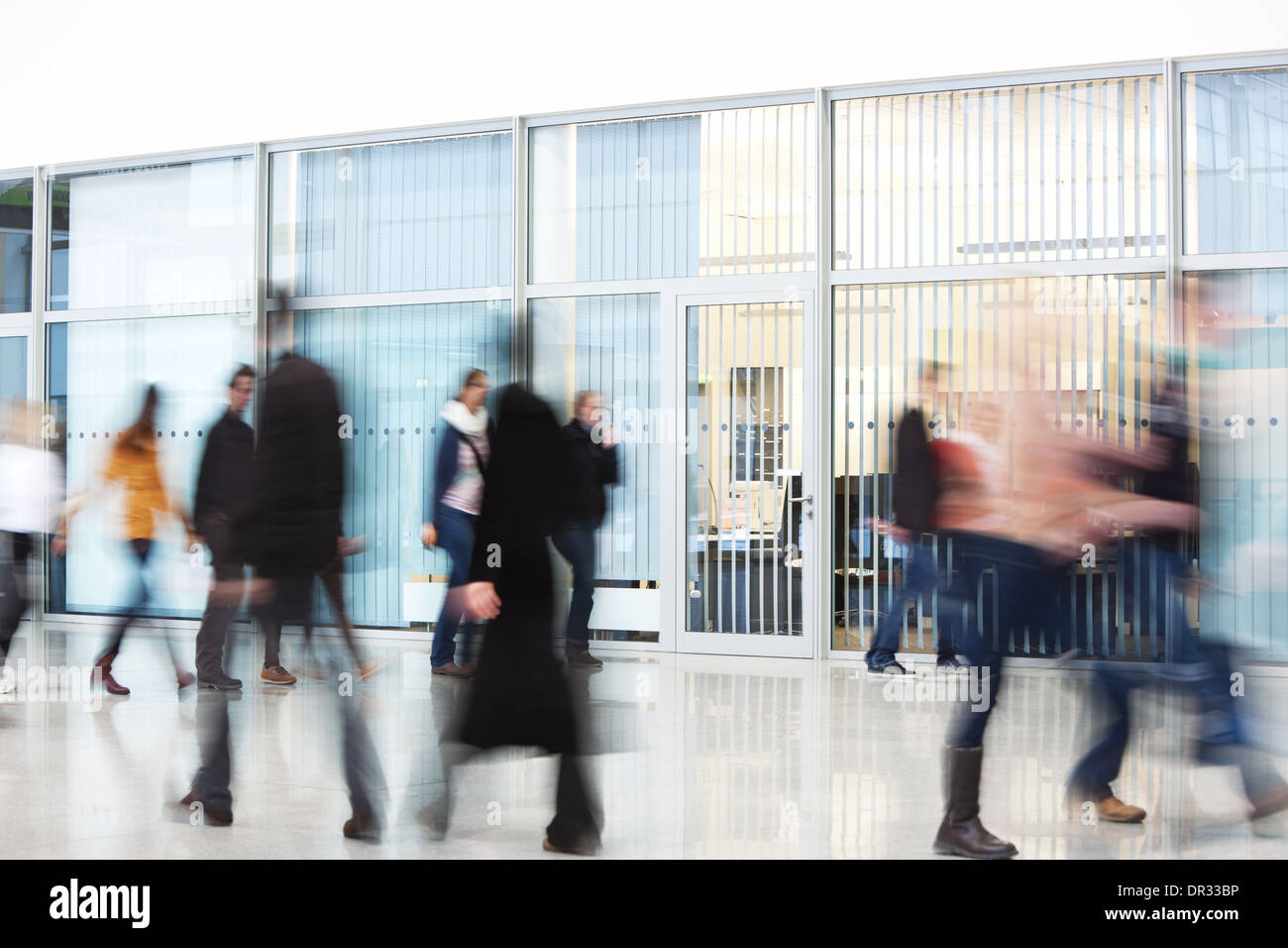 motion blurred people in office building Stock Photo - Alamy