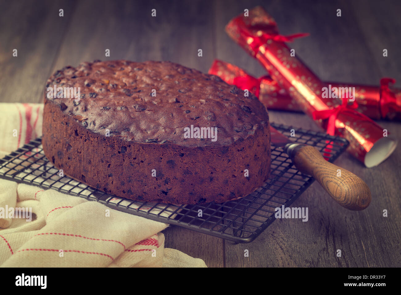 Christmas cake on cooling rack with vintage toned effect Stock Photo ...