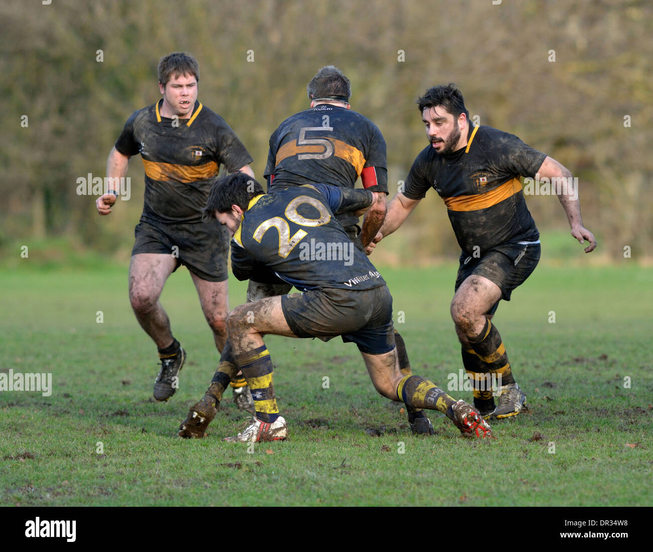 a rugby player tackles another player during a match between didsbury ...