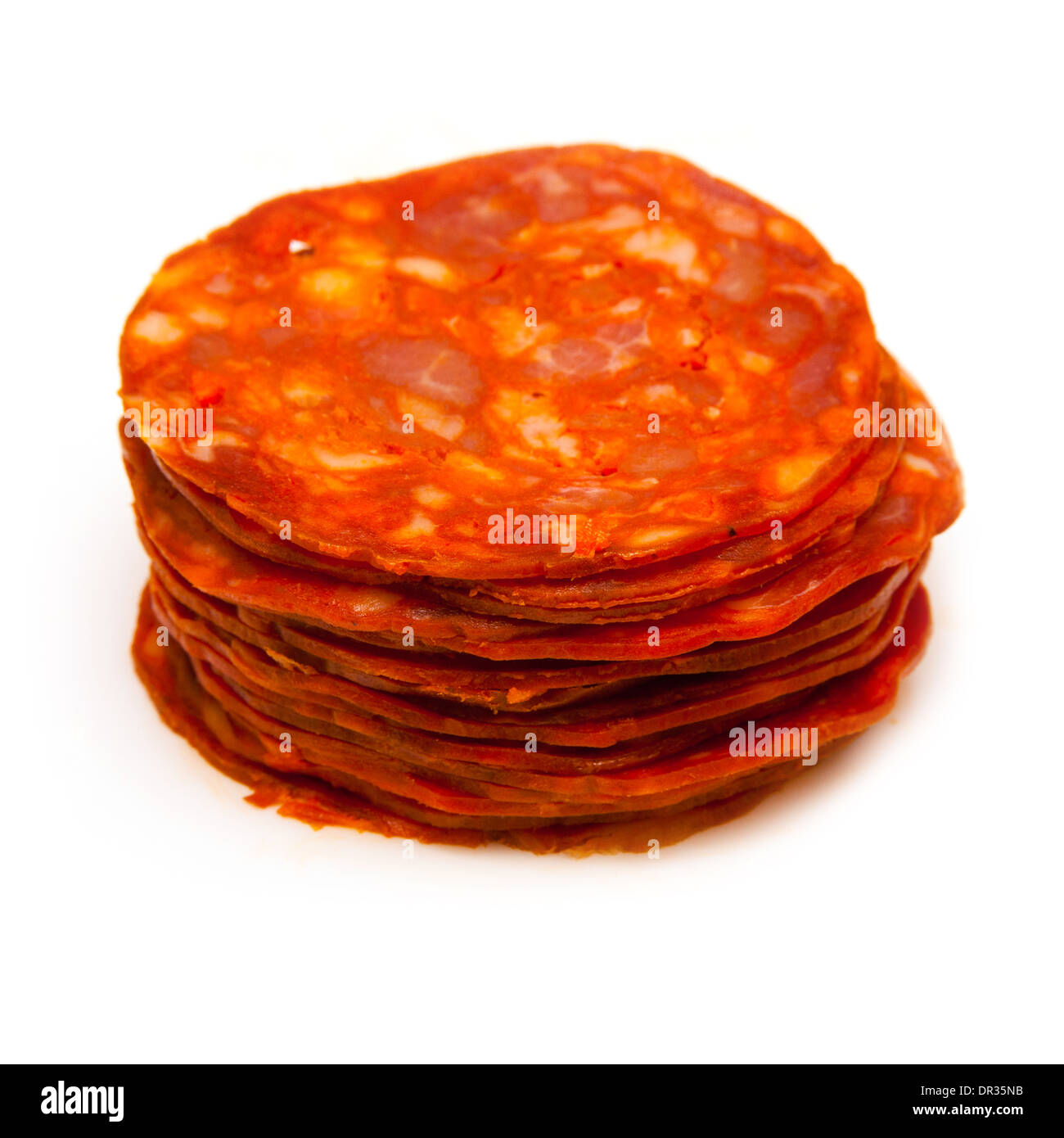 Sliced Spanish chorizo sausage isolated on a white studio background ...