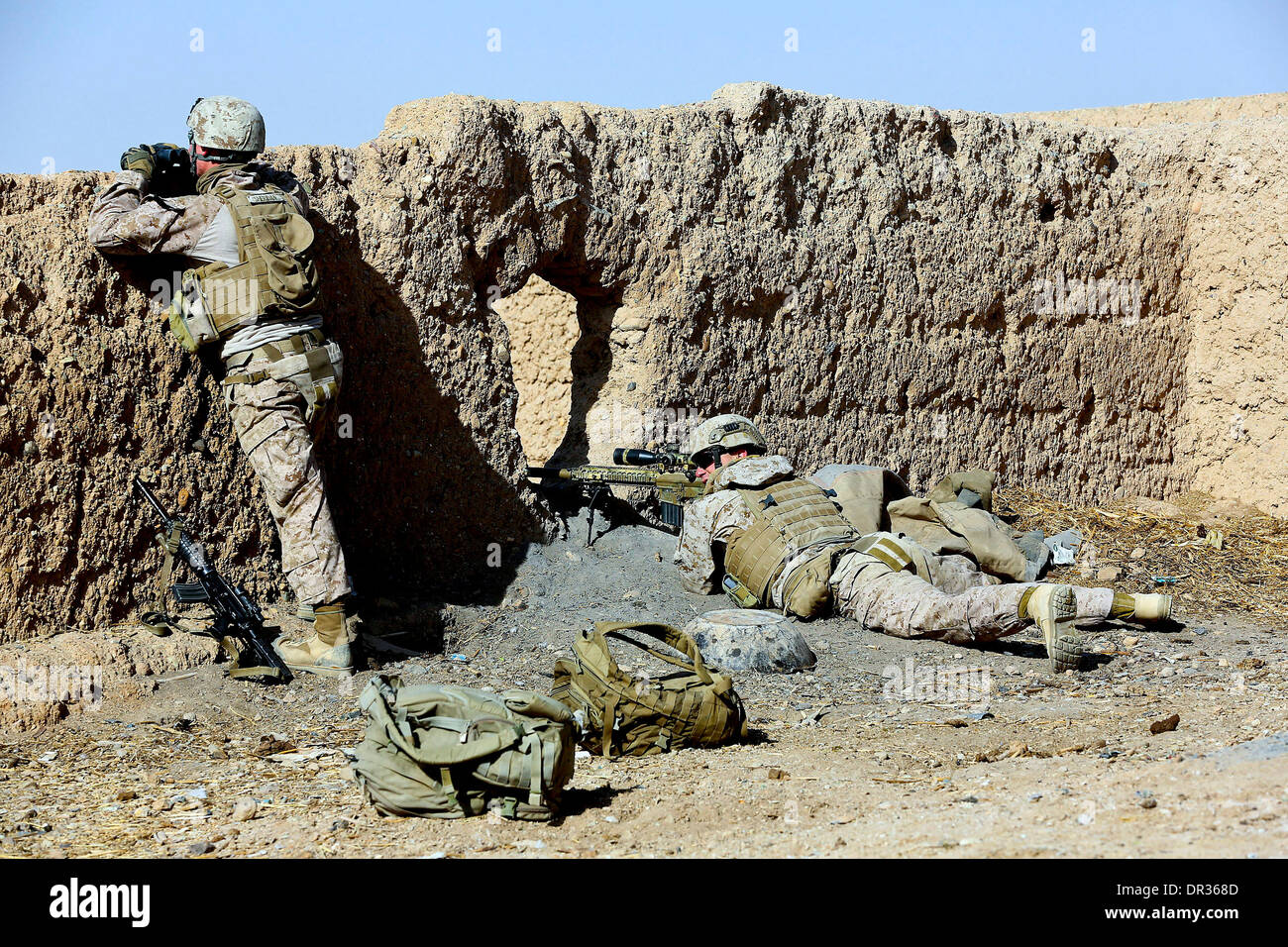 U.S. Marines soldiers take cover during a patrol in Helmand province ...