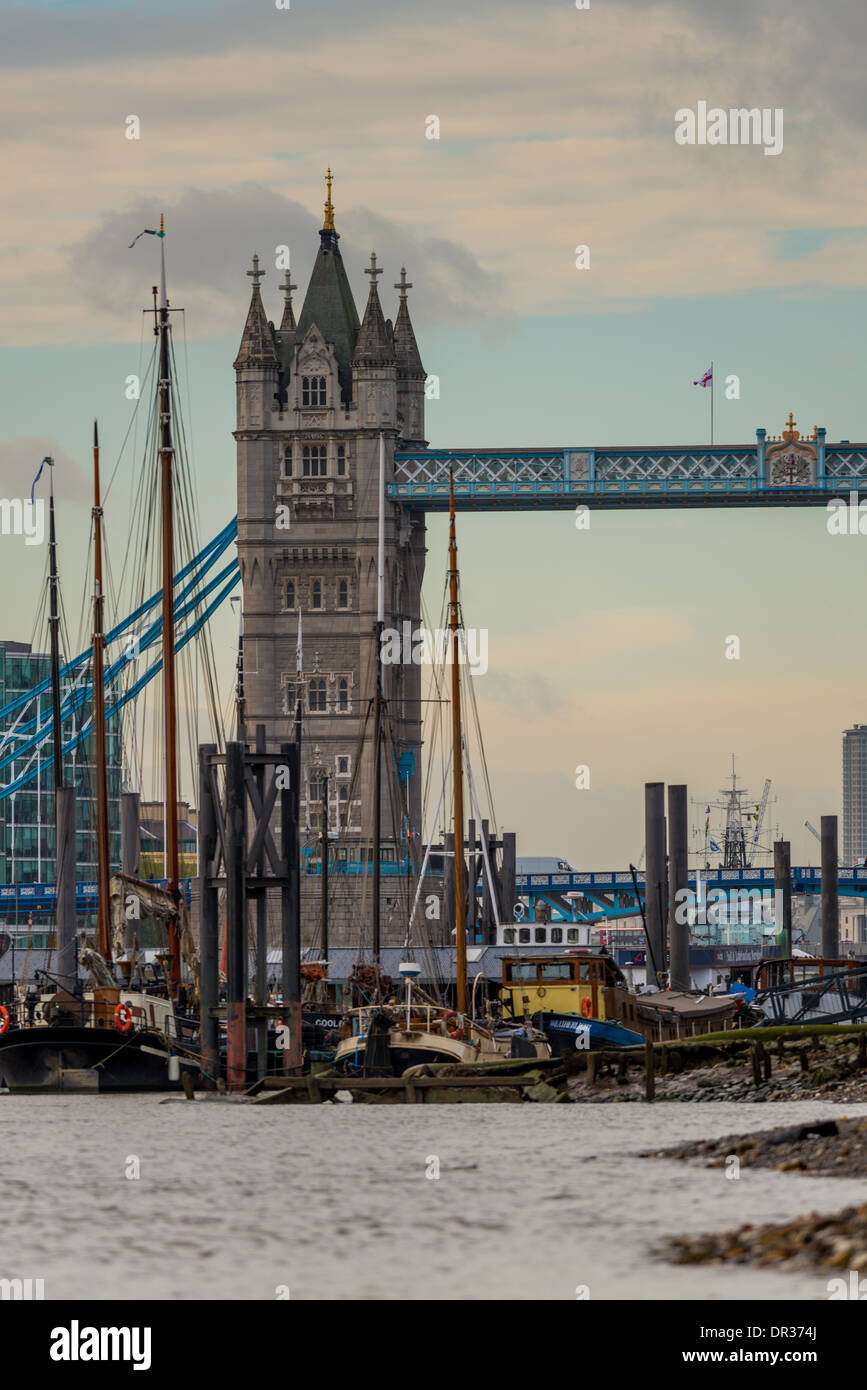 Boats moored in Wapping in front of London's landmark Tower Bridge ...