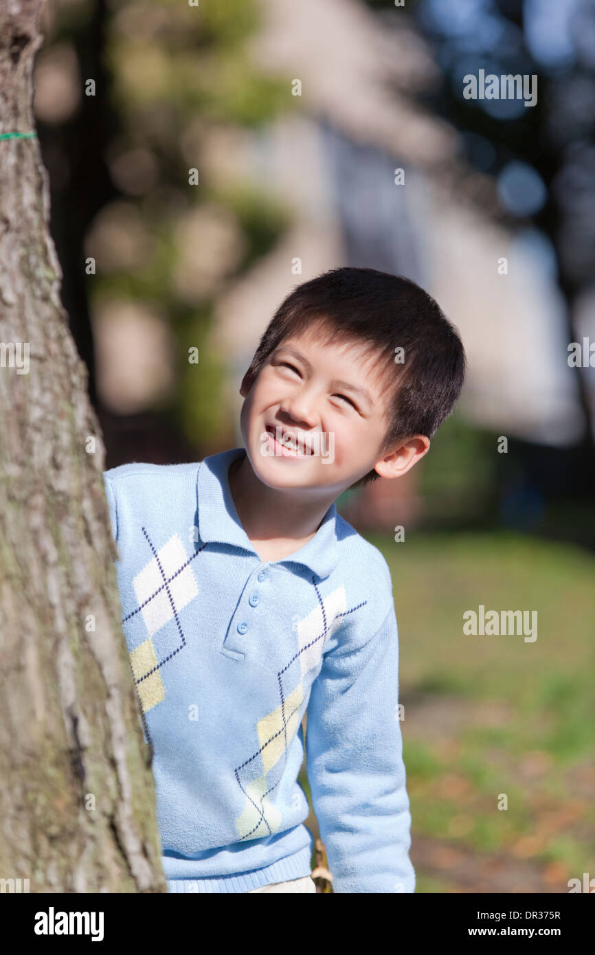 Boy playing in park Stock Photo - Alamy