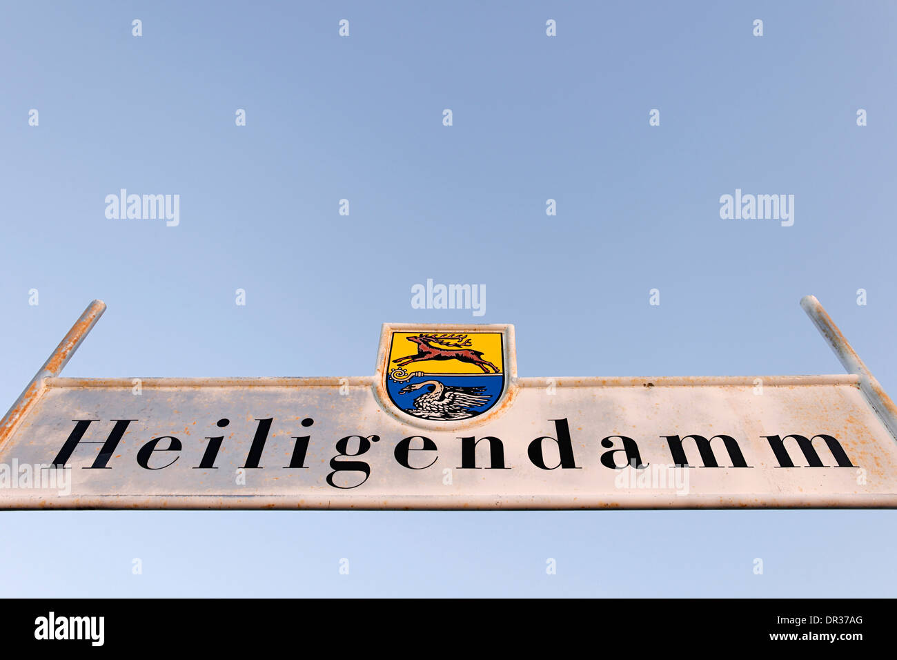 Pier sign beach promenade at sunset seaside resort of Ostseeheilbad ...