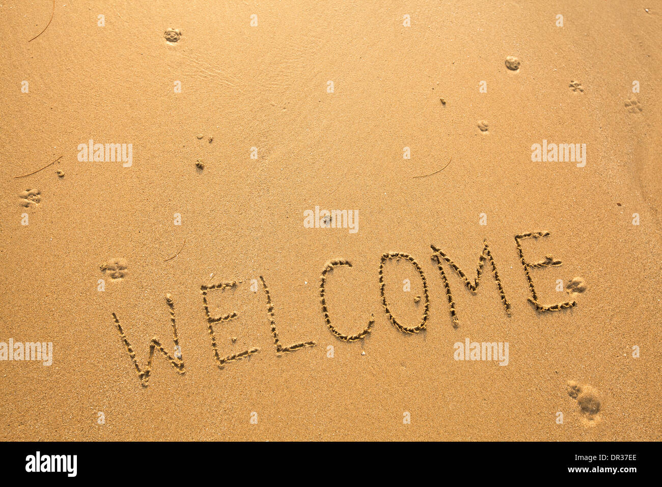 Welcome. Texture on the sand Stock Photo - Alamy