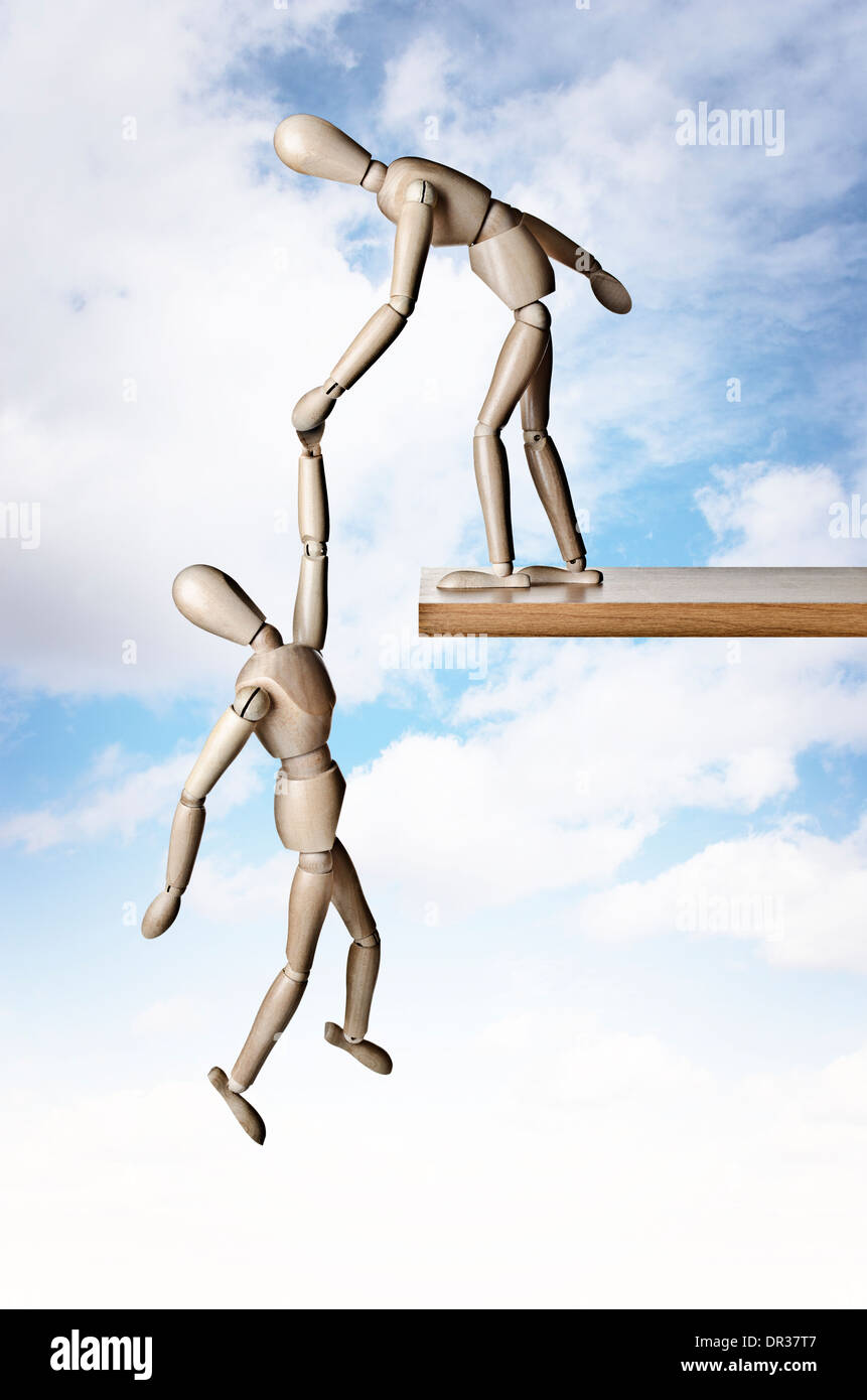 Savior. A manikin holding another manikin from falling off a ledge ... Savior. A manikin holding another manikin from falling off a ledge ...