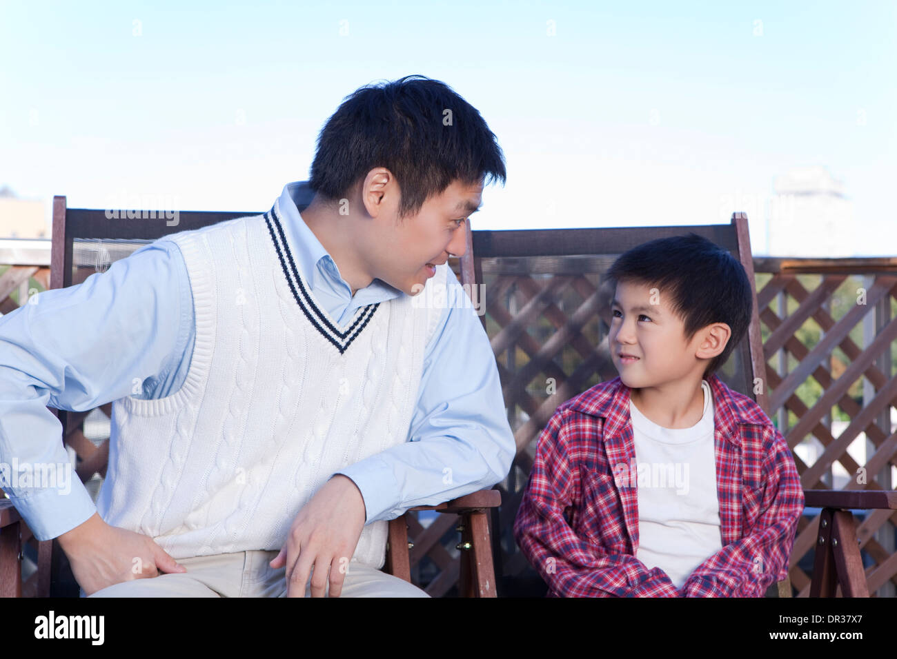 Father and son talking Stock Photo - Alamy
