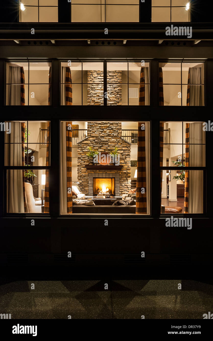 View of interior of living room in luxury home through a window Stock ...