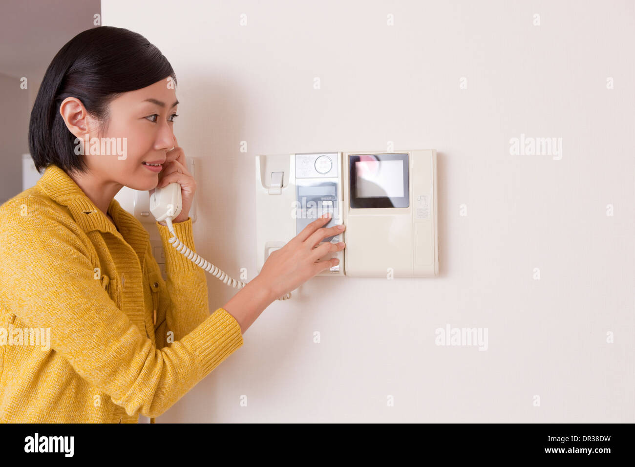 Answering intercom hi-res stock photography and images - Alamy