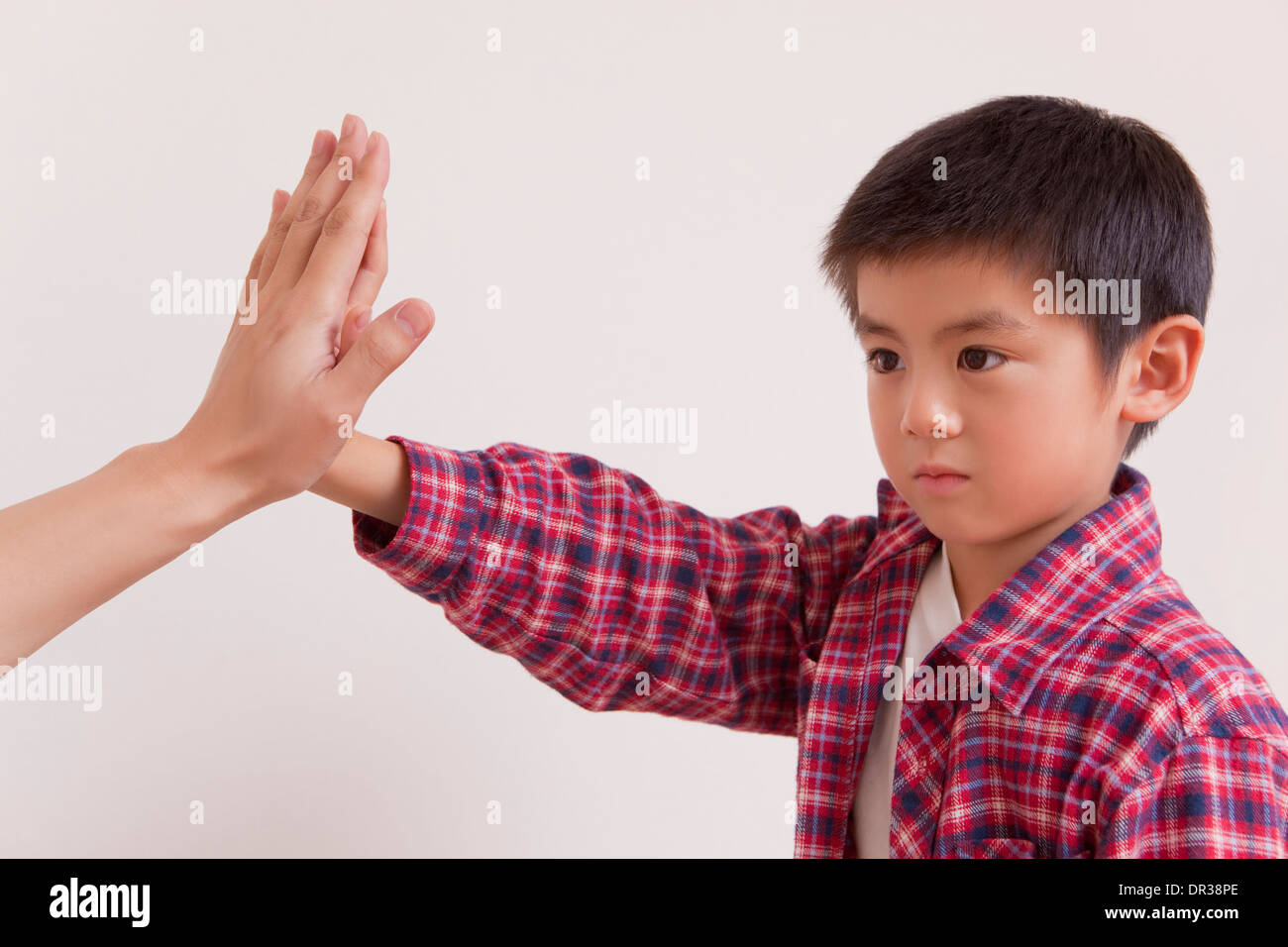 Father and son giving each other high five Stock Photo - Alamy