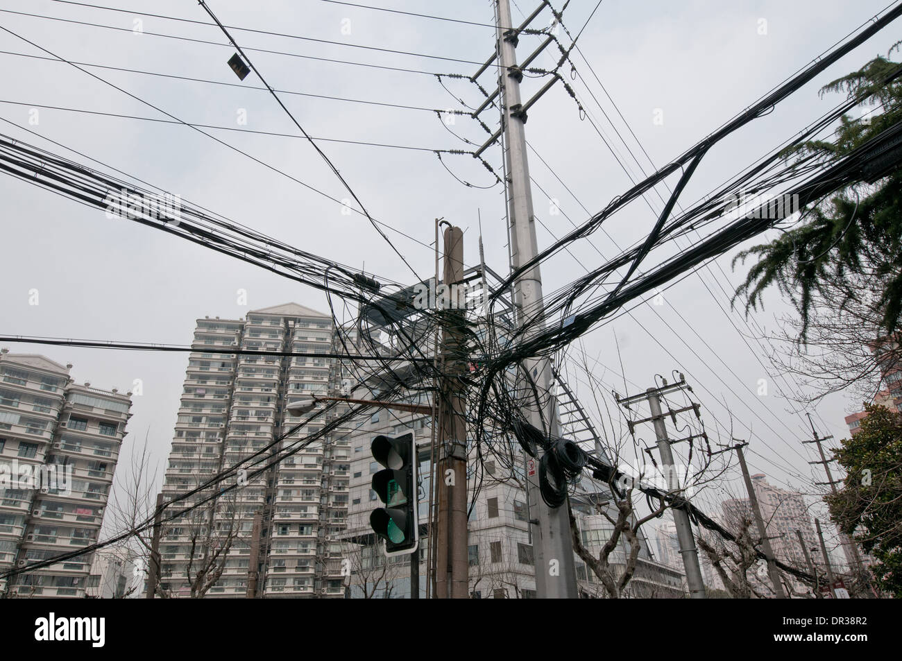 Cables and wires with multi-storey buildings on background in Shanghai ...