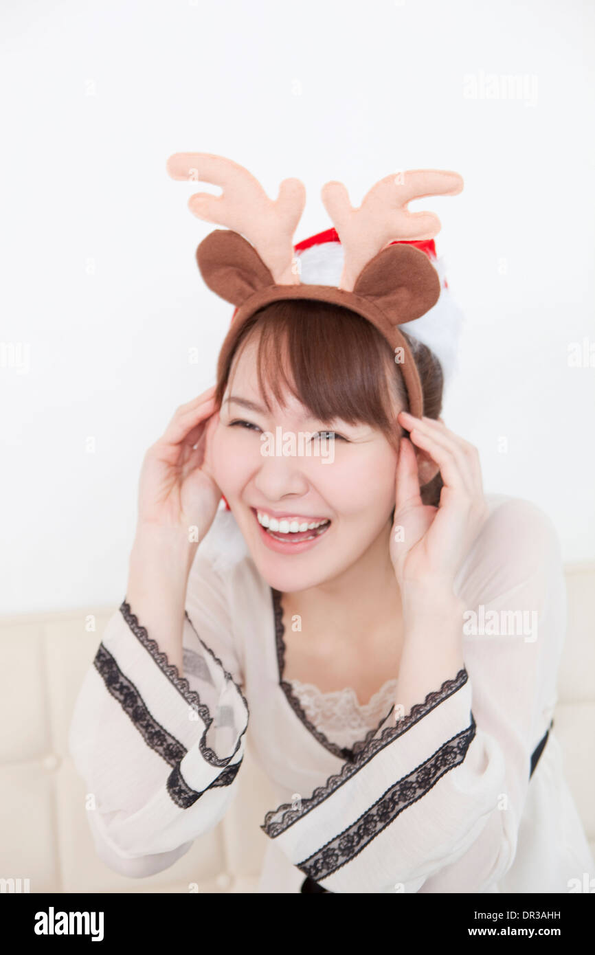 Young woman with reindeer antlers Stock Photo - Alamy