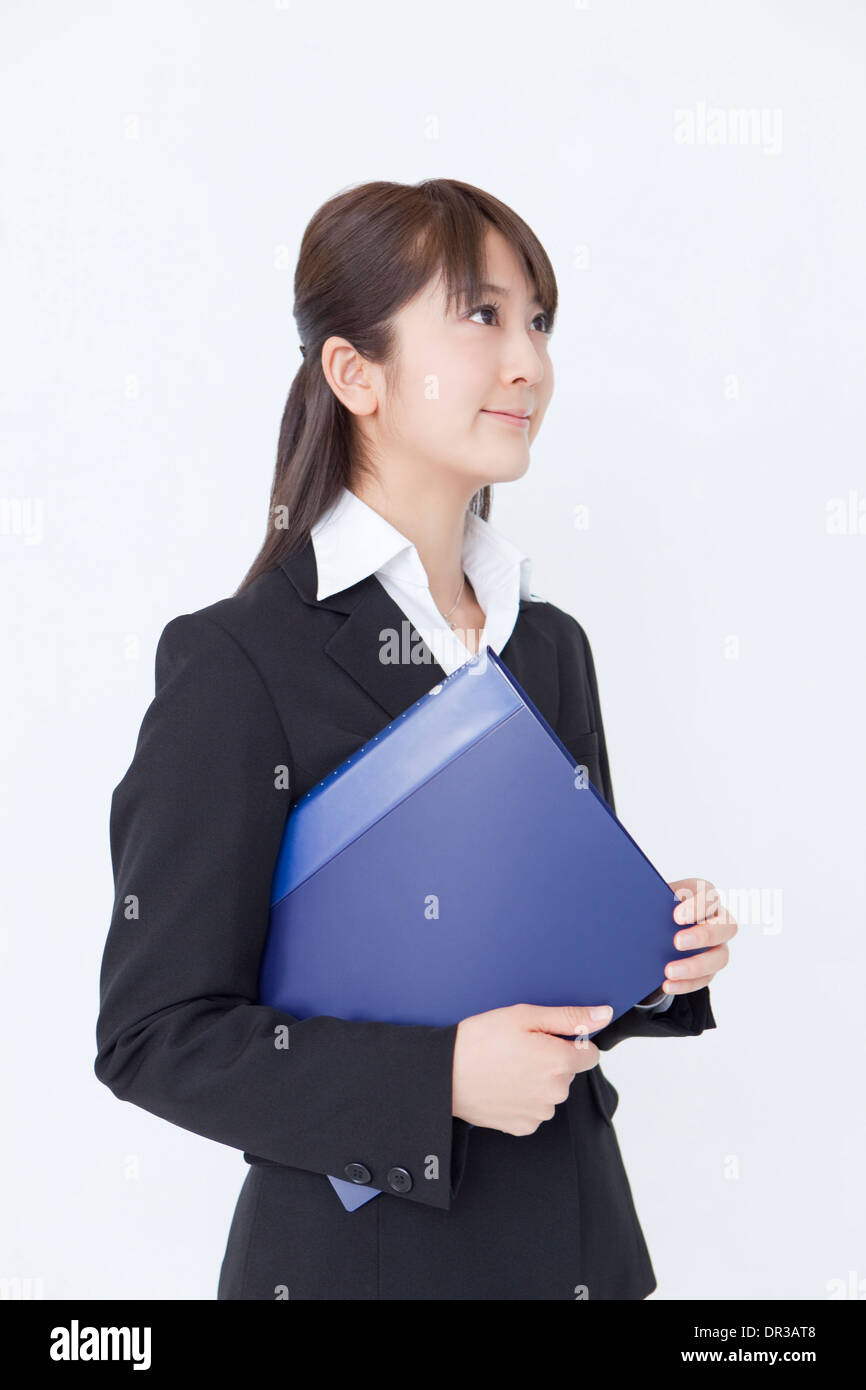 Young business woman holding files Stock Photo - Alamy