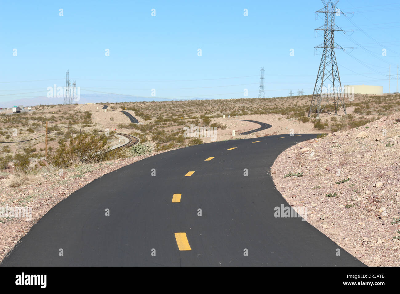Paved Hiking trail, winding road through mountains Stock Photo - Alamy
