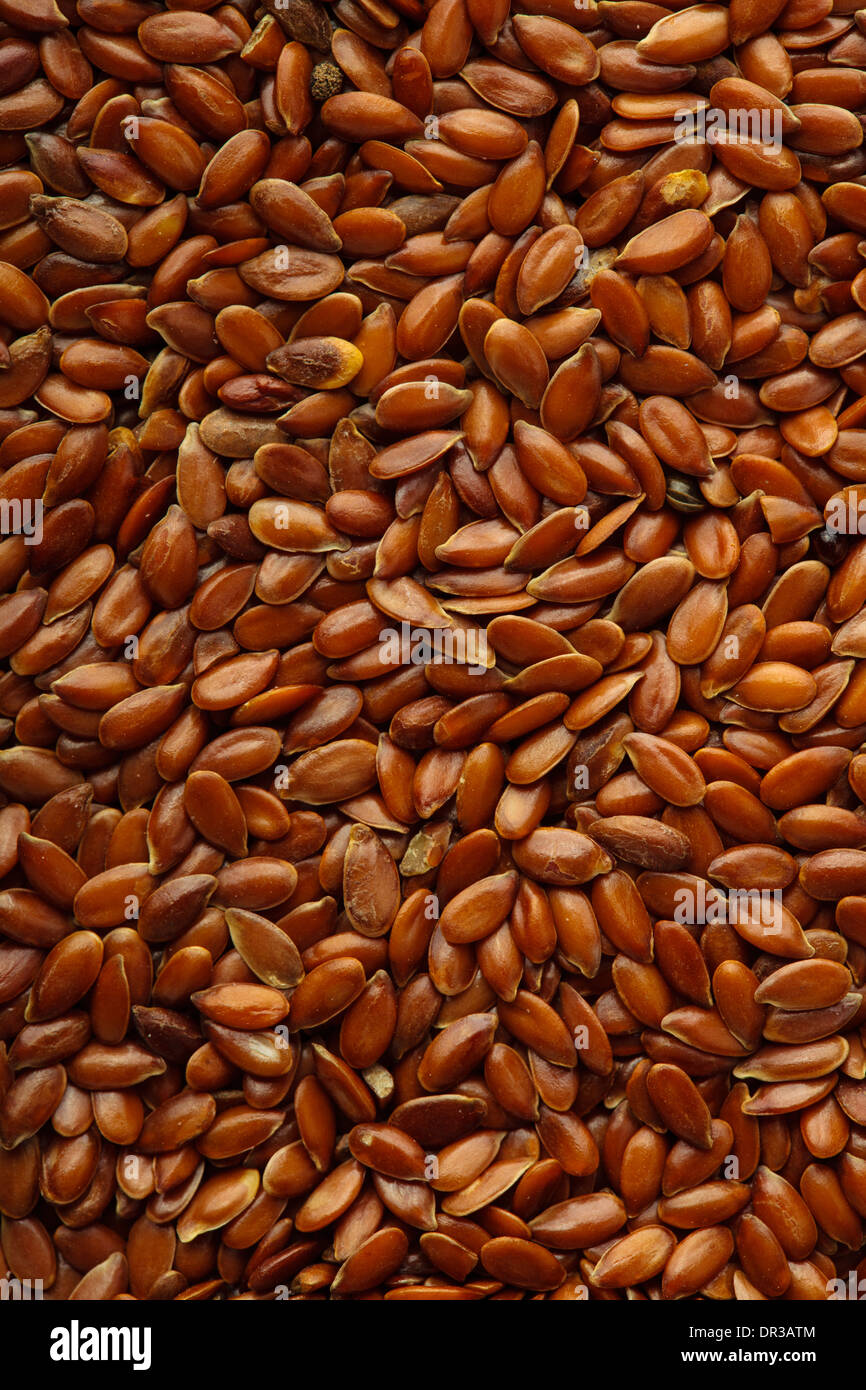 Healthy diet organic nutrition. Brown raw flax seeds linseed as natural food background Stock ...