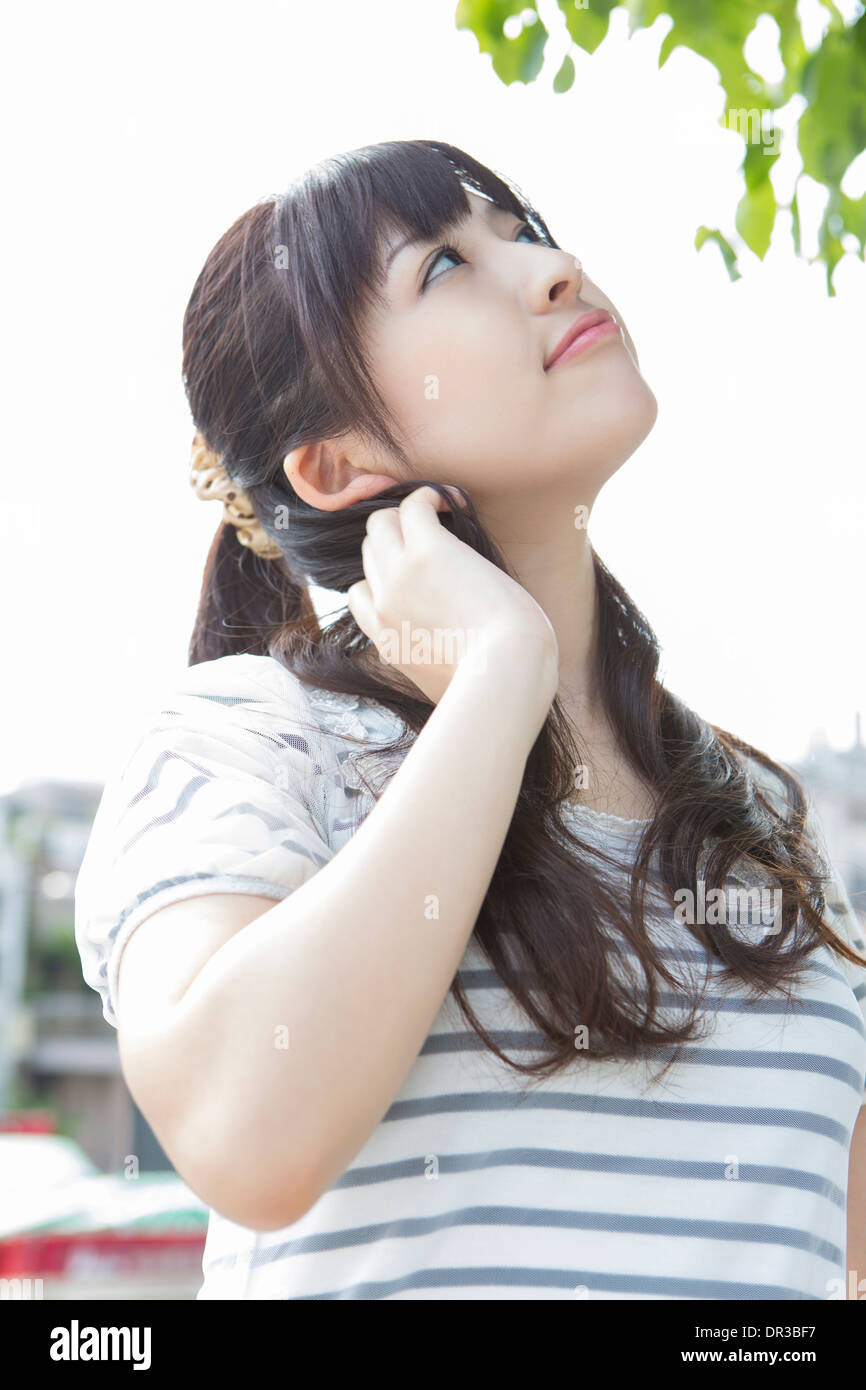 Young woman looking up Stock Photo - Alamy