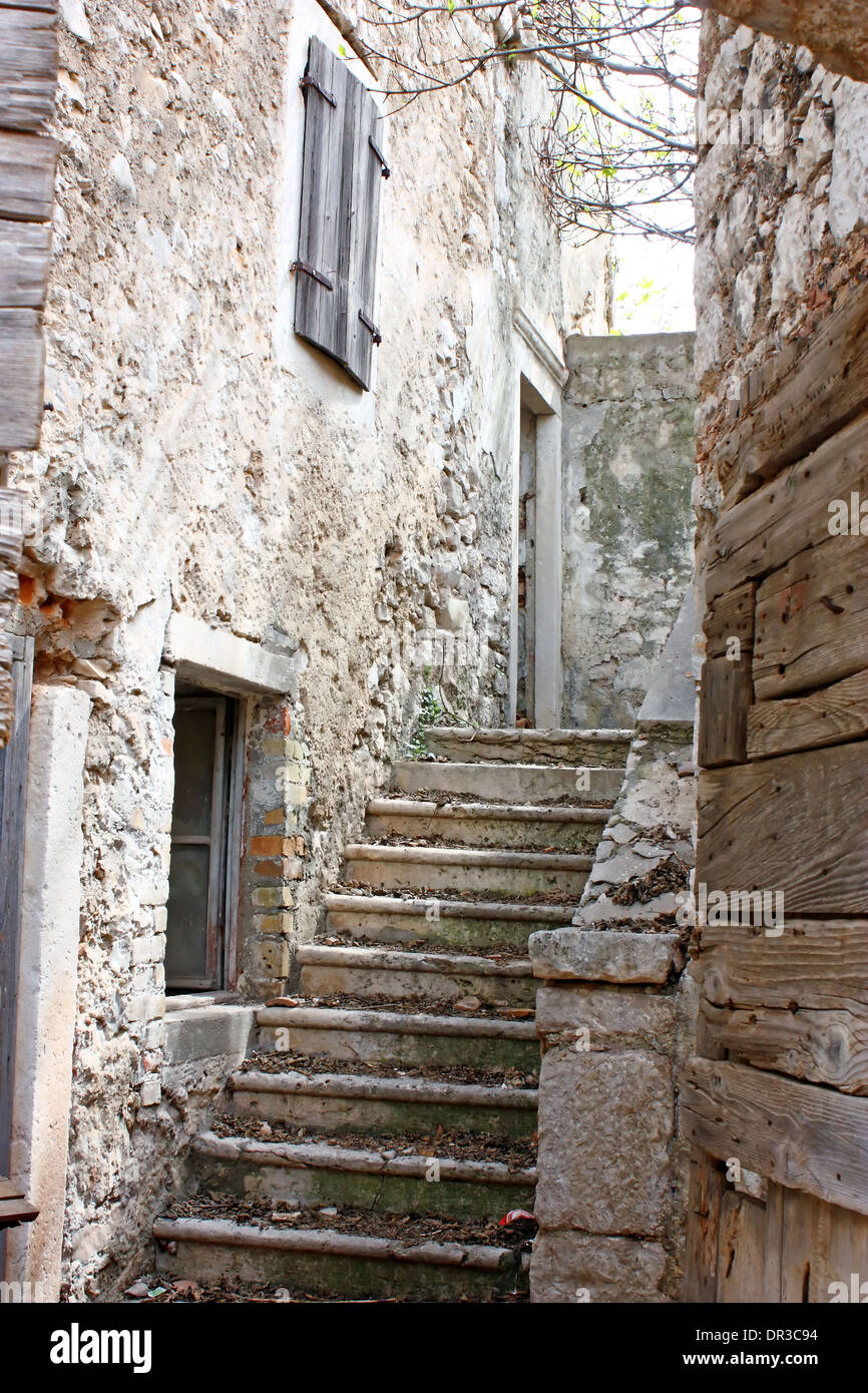 Retro image of old stone stairs and house Stock Photo - Alamy