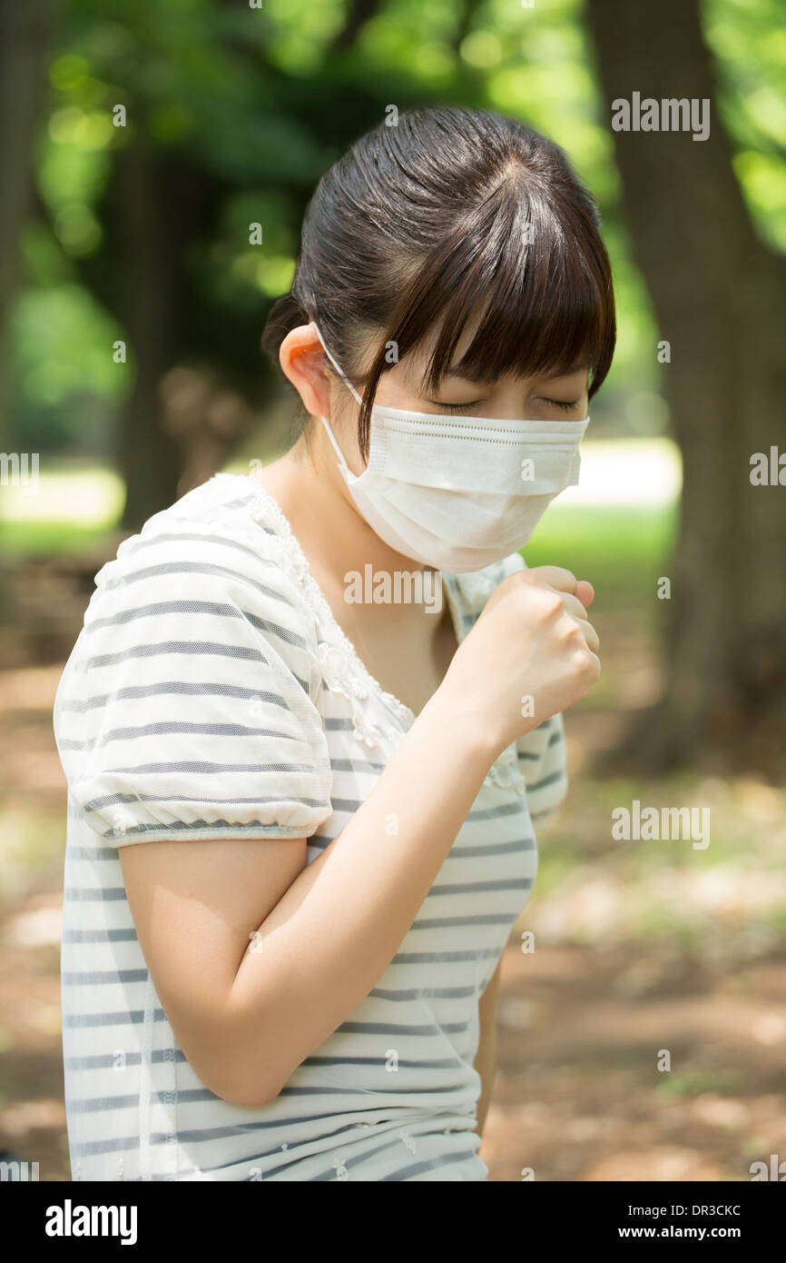 Young woman coughing Stock Photo - Alamy