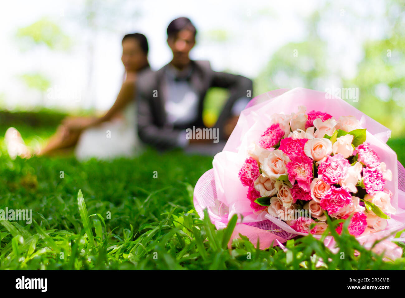 Wedding couple with flower Stock Photo - Alamy