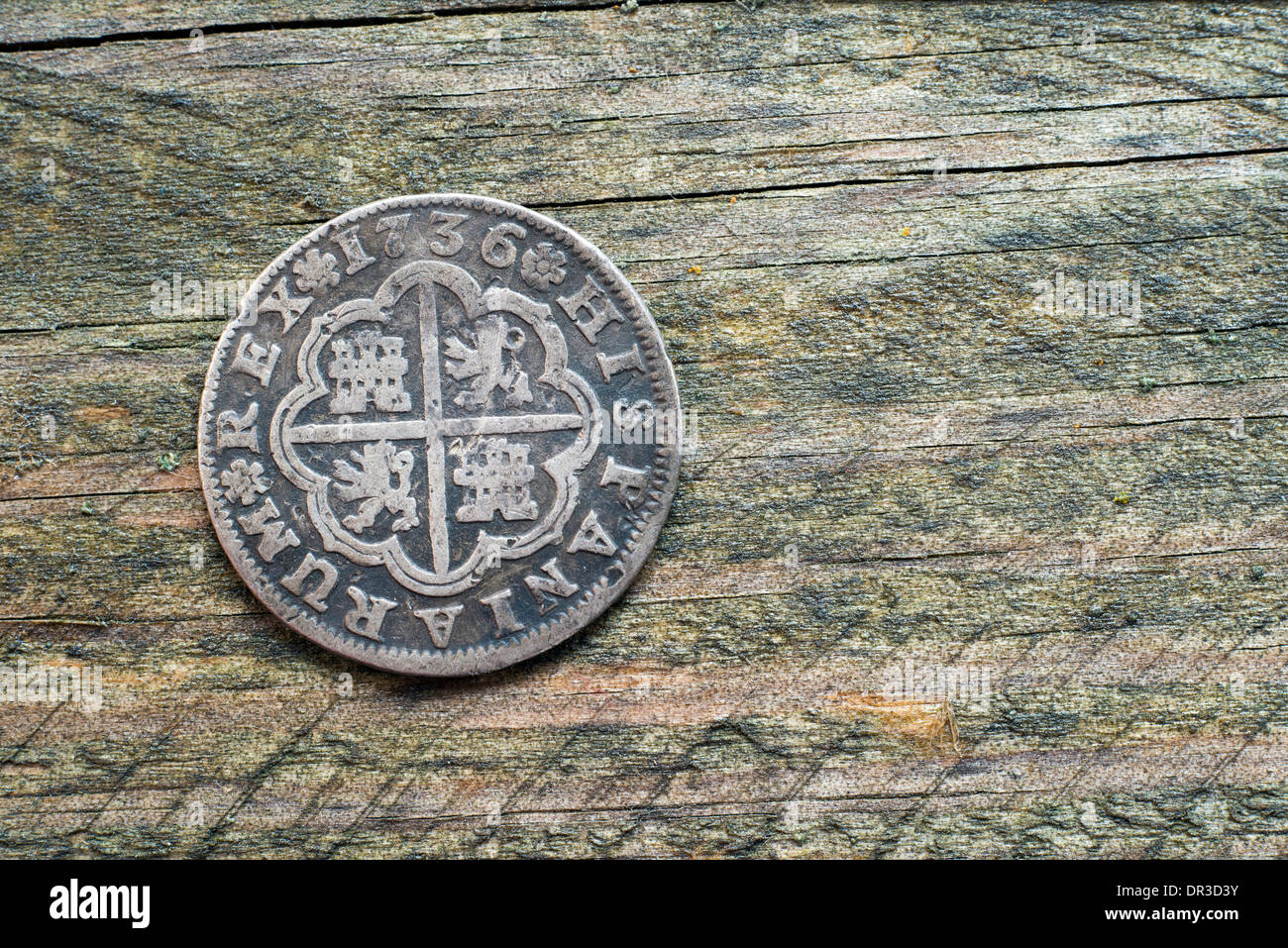 Old Spanish silver coin on wood Stock Photo - Alamy