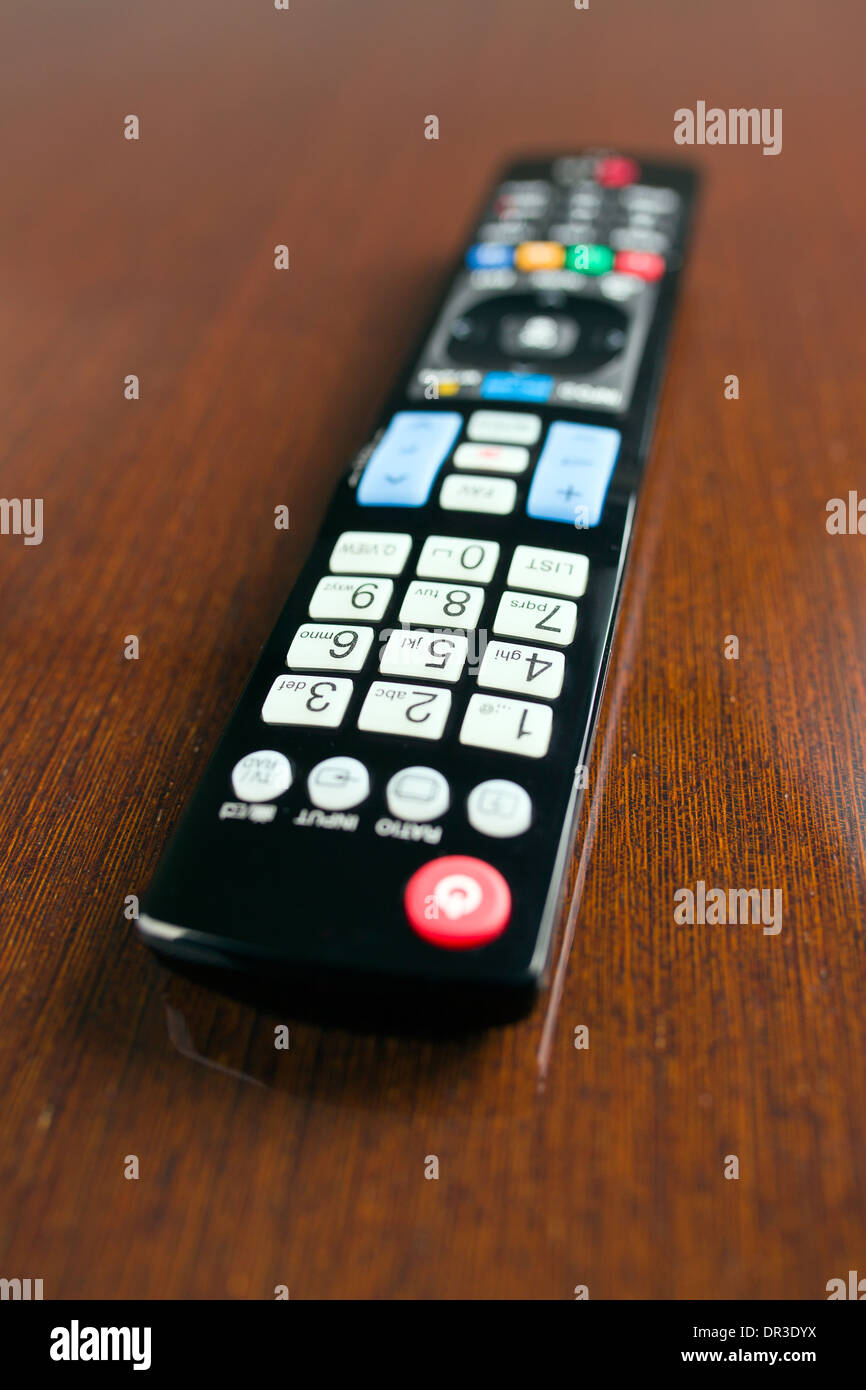 Tv table and controller hi-res stock photography and images - Alamy
